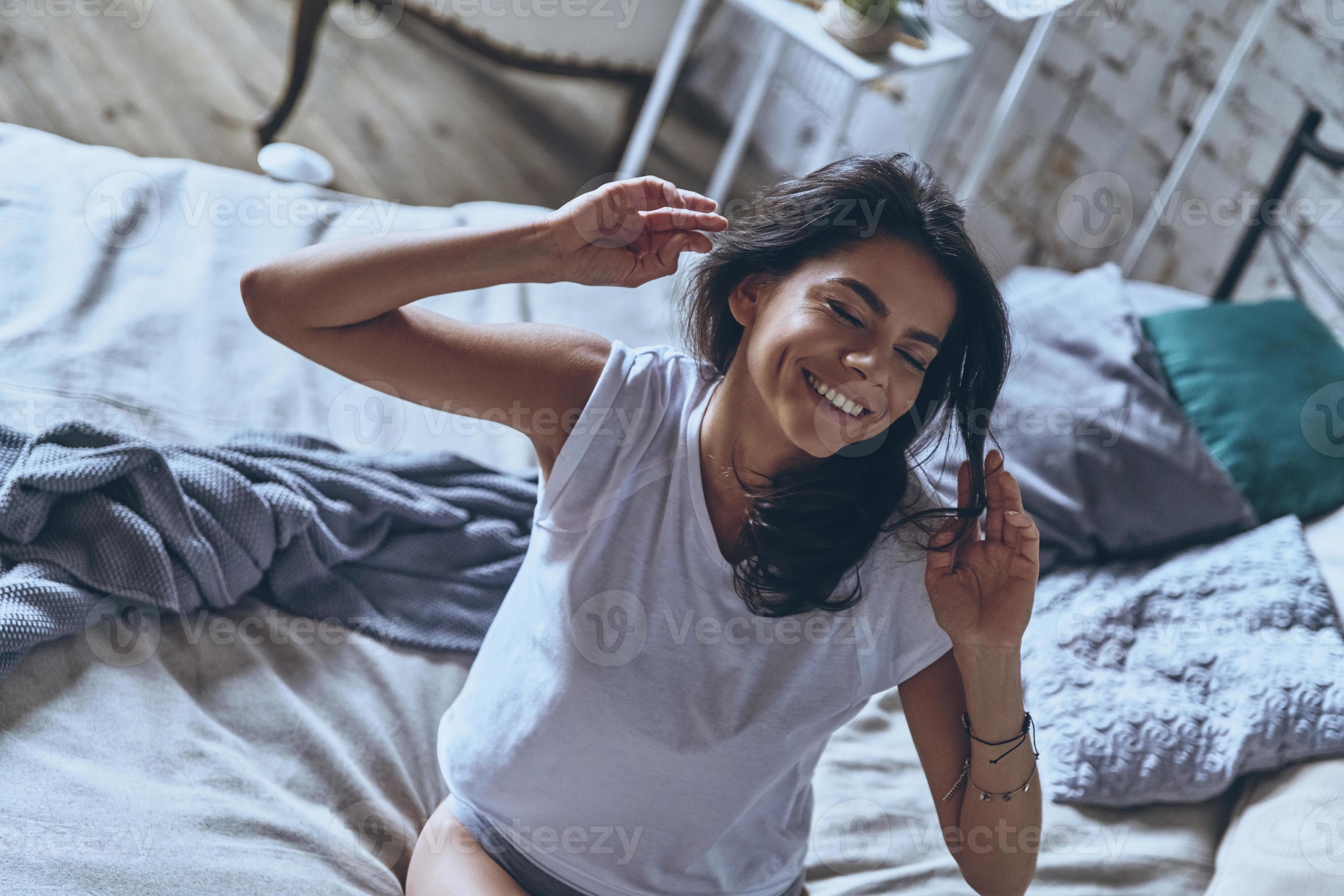 Feeling happy and refreshed. Top view of beautiful young woman ... Feeling happy and refreshed. Top view of beautiful young woman ...