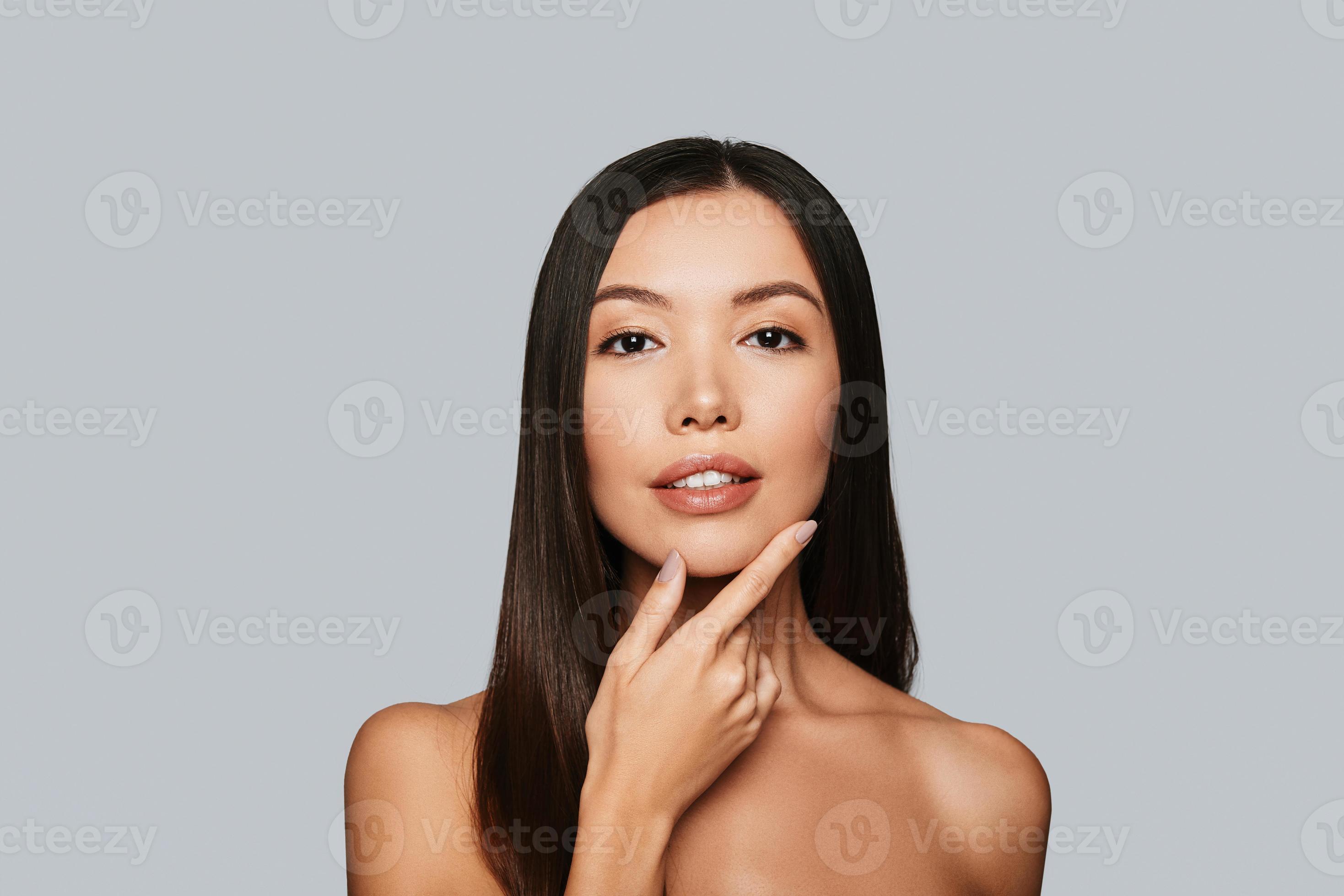 Sensitive Care For A Luminous Skin Beautiful Young Asian Woman Looking