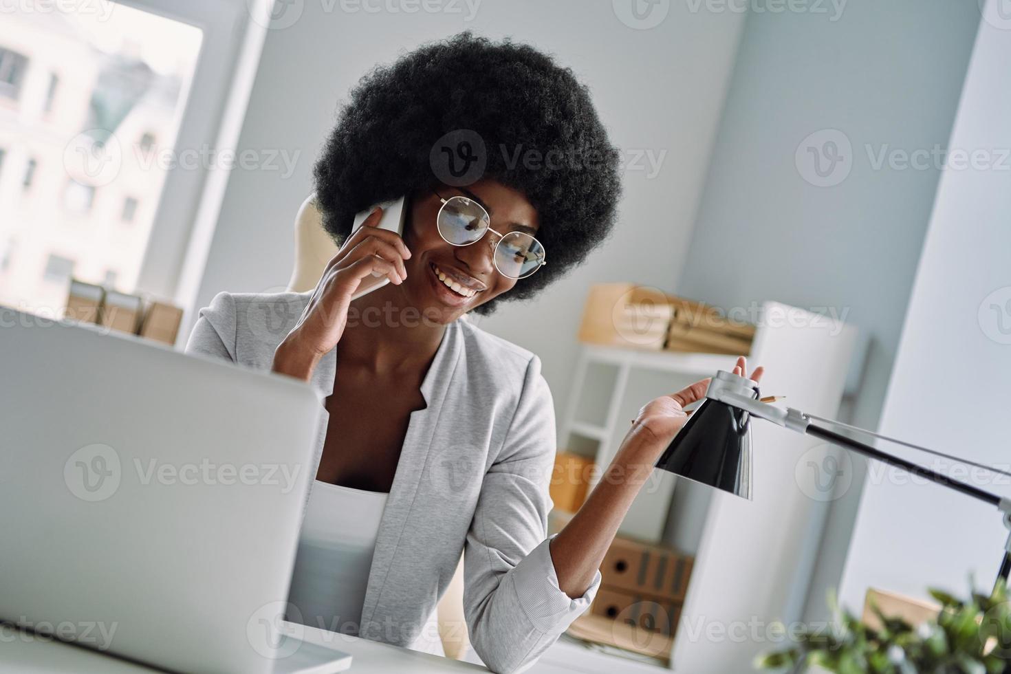 Beautiful Young African Woman Talking On Mobile Phone And Smiling While