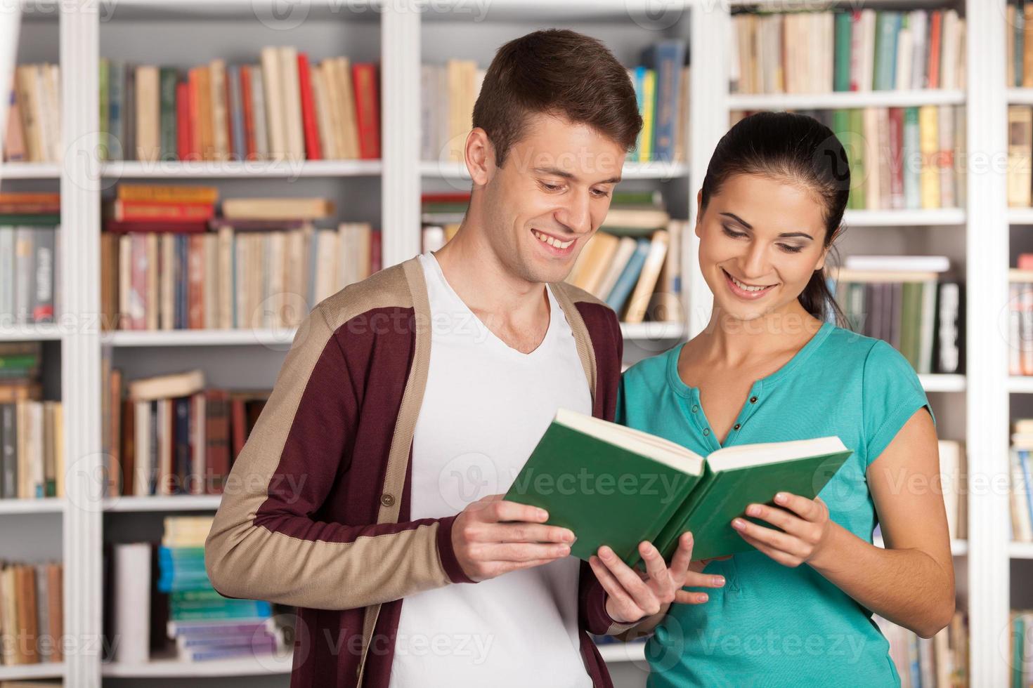 Reading A Book Together Cheerful Young Man And Woman Reading Book