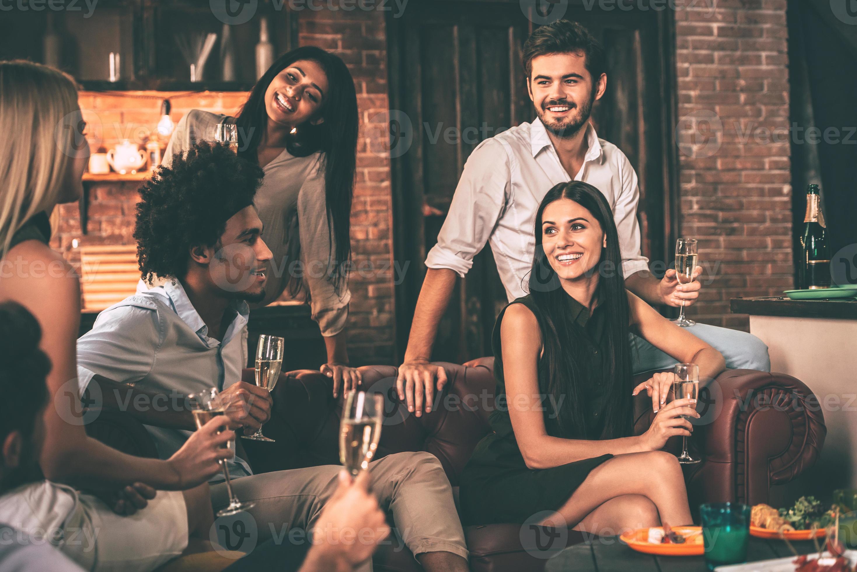 Friends Gathering Group Of Cheerful Young People Enjoying Food And Drinks While Spending Nice
