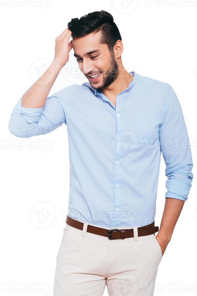 Used to look perfect. Handsome young Indian man holding hand in hair ...