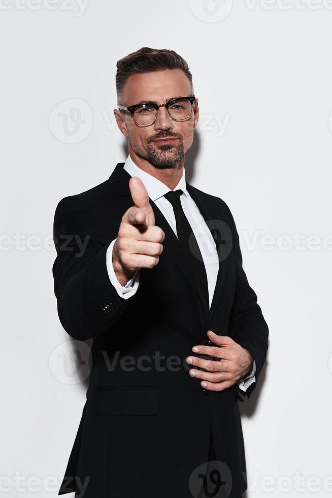 I need you Handsome young man in full suit pointing you and looking at ...