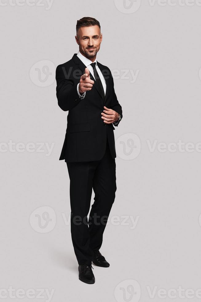 You are the one I need Full length of handsome young man in full suit ...