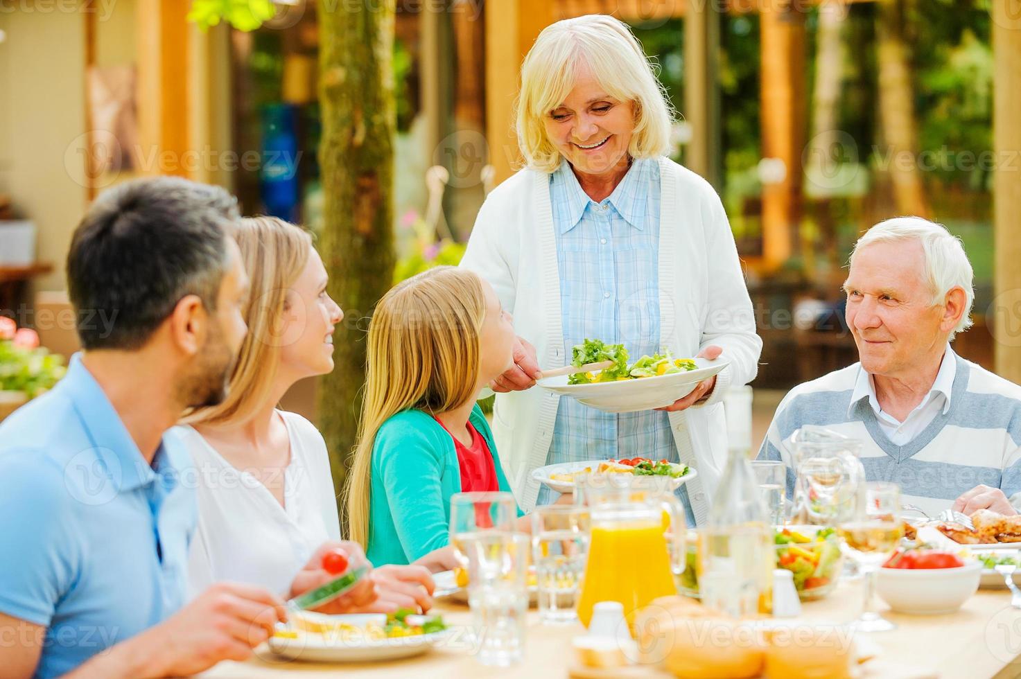Enjoying family time. Happy family of five people enjoying meal ... Enjoying family time. Happy family of five people enjoying meal ...