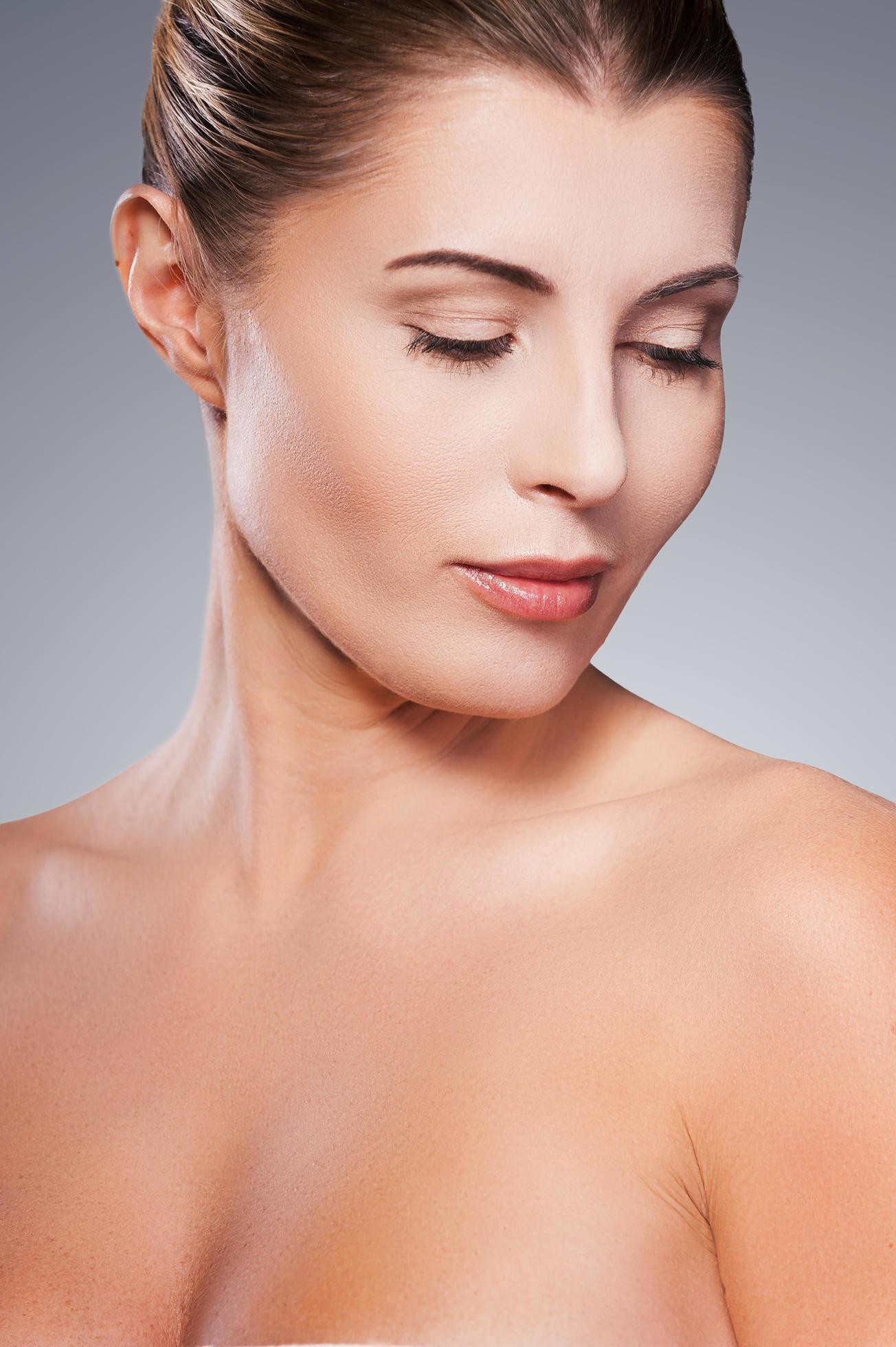 Fresh And Beautiful Portrait Of Shirtless Mature Woman Looking At Her Shoulder While Standing