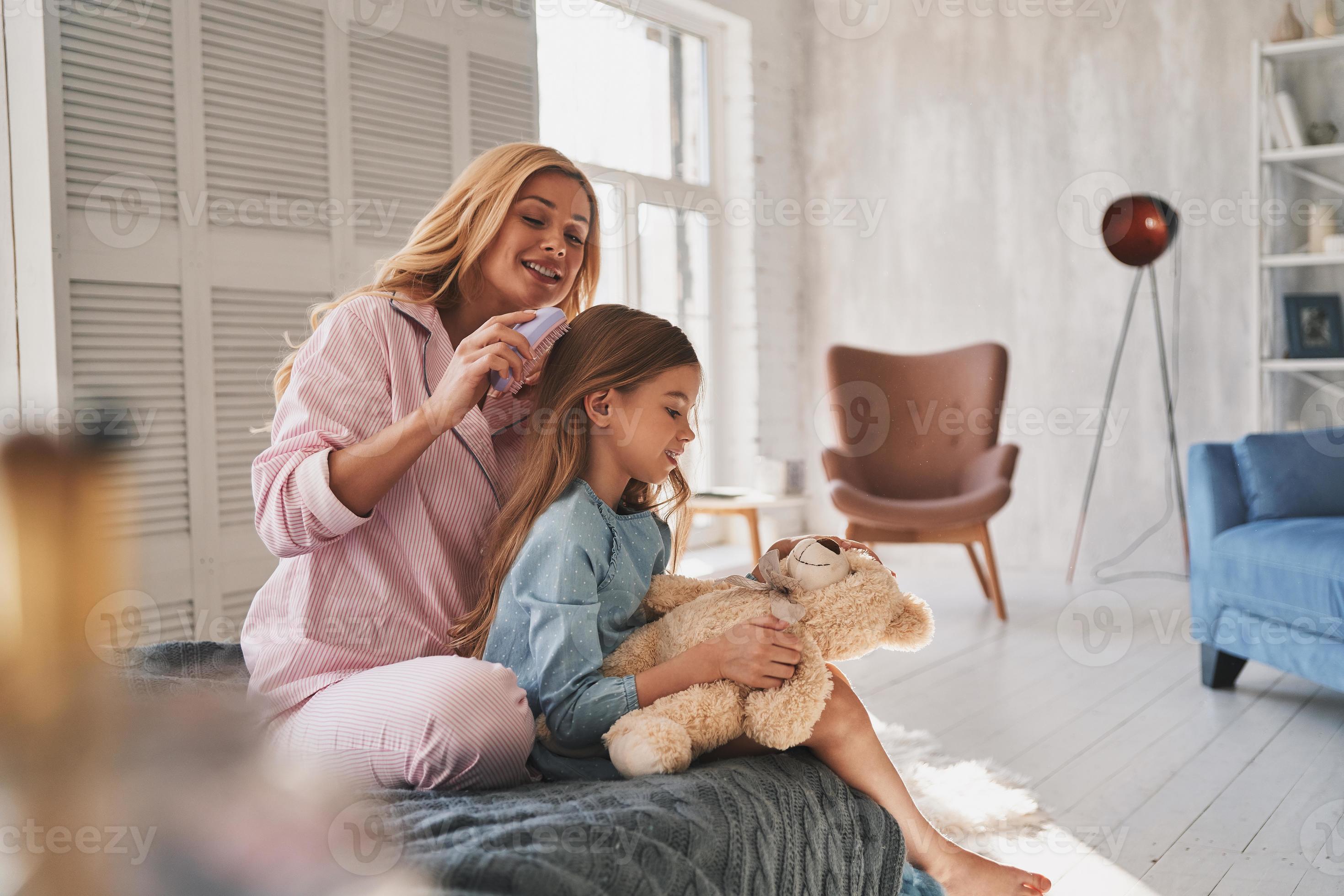 Hair Care Beautiful Young Mother Brushing Her Daughters Hair While