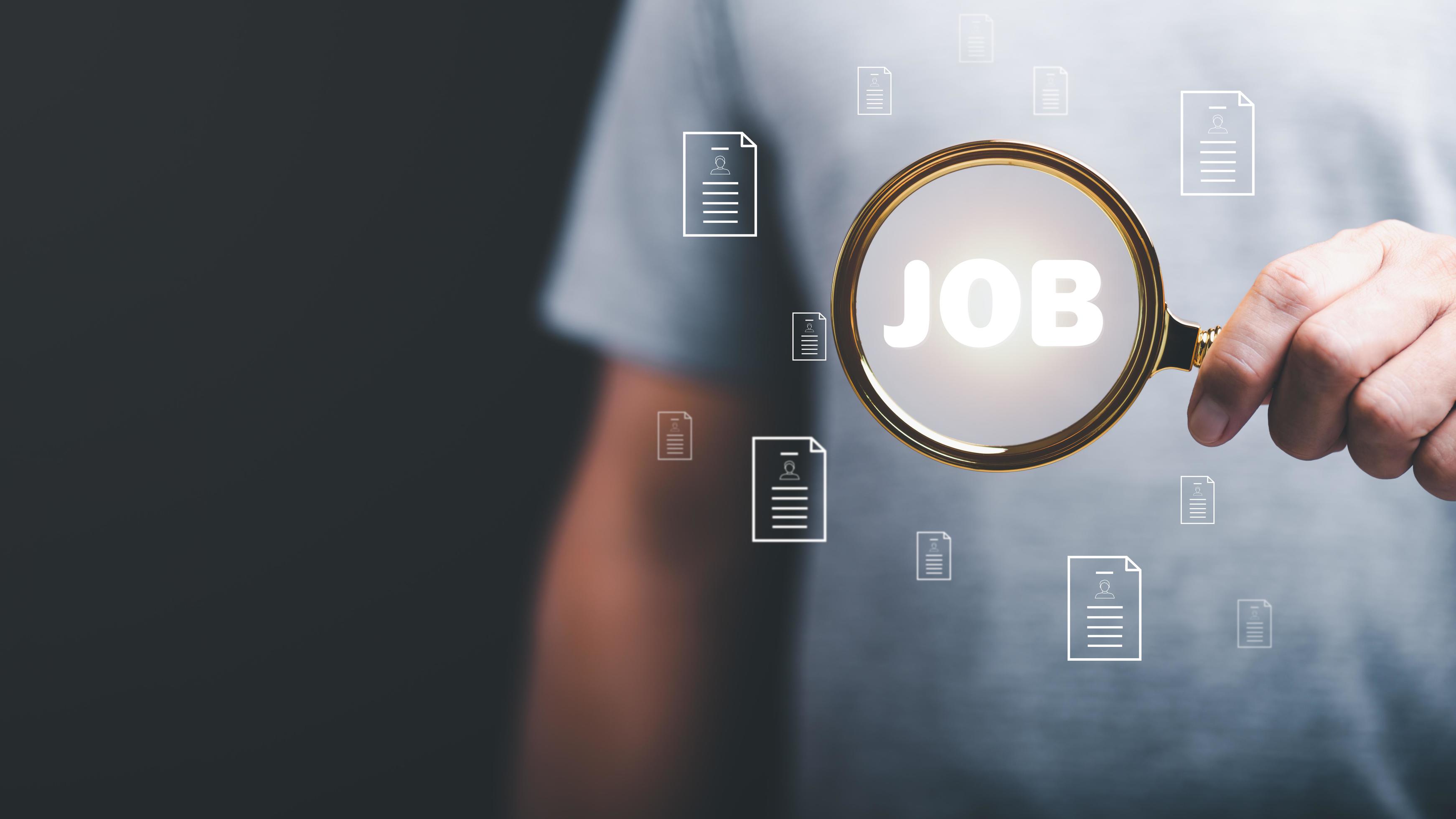 Man holding a magnifying glass, concept, job search, recruitment, unemployment, vacancy, looking ...