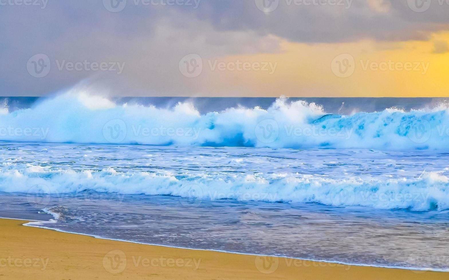Colorful golden sunset big wave and beach Puerto Escondido Mexico ...