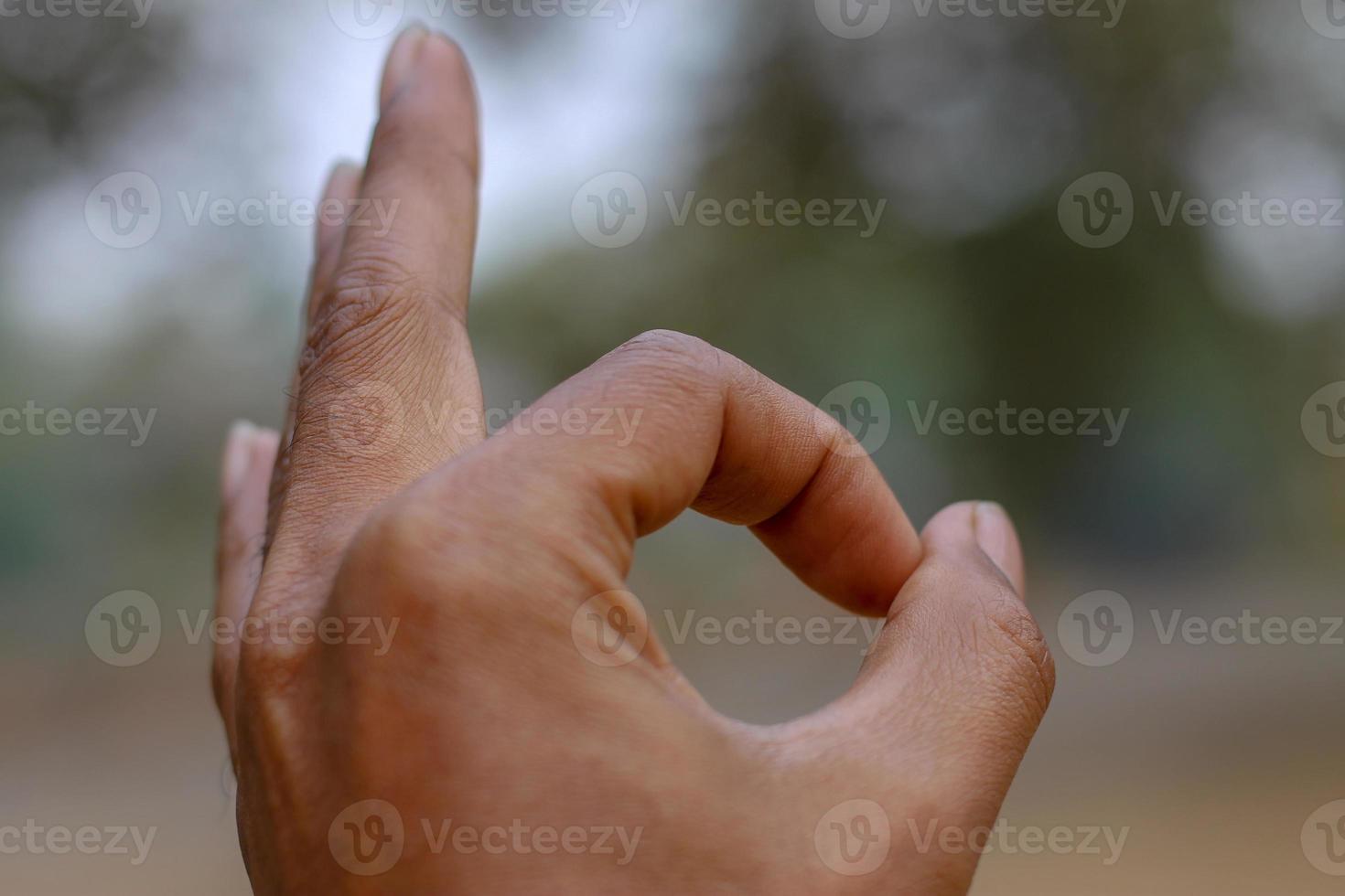 hand ok sign on boke blurred background 13682634 Stock Photo at Vecteezy