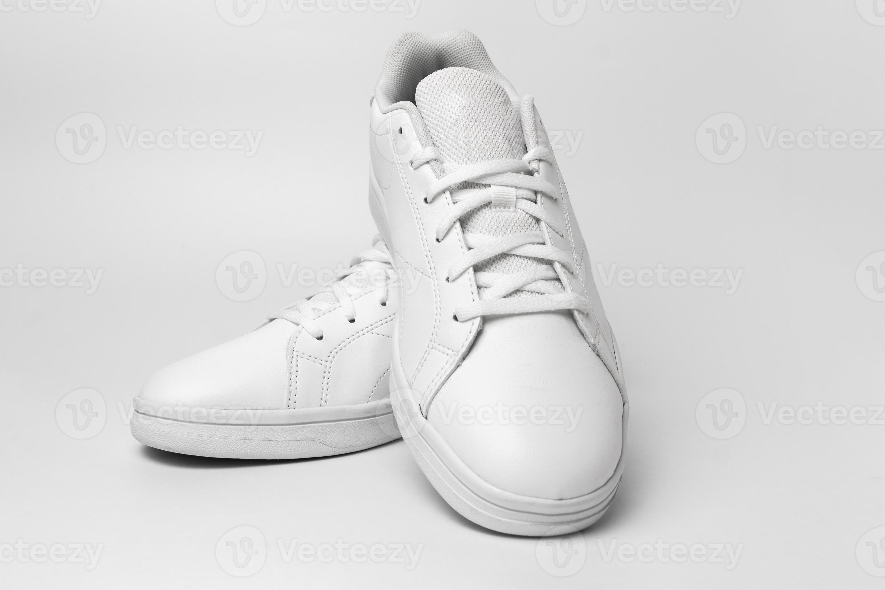 New pair of white sneakers isolated on white background for cutting out ...