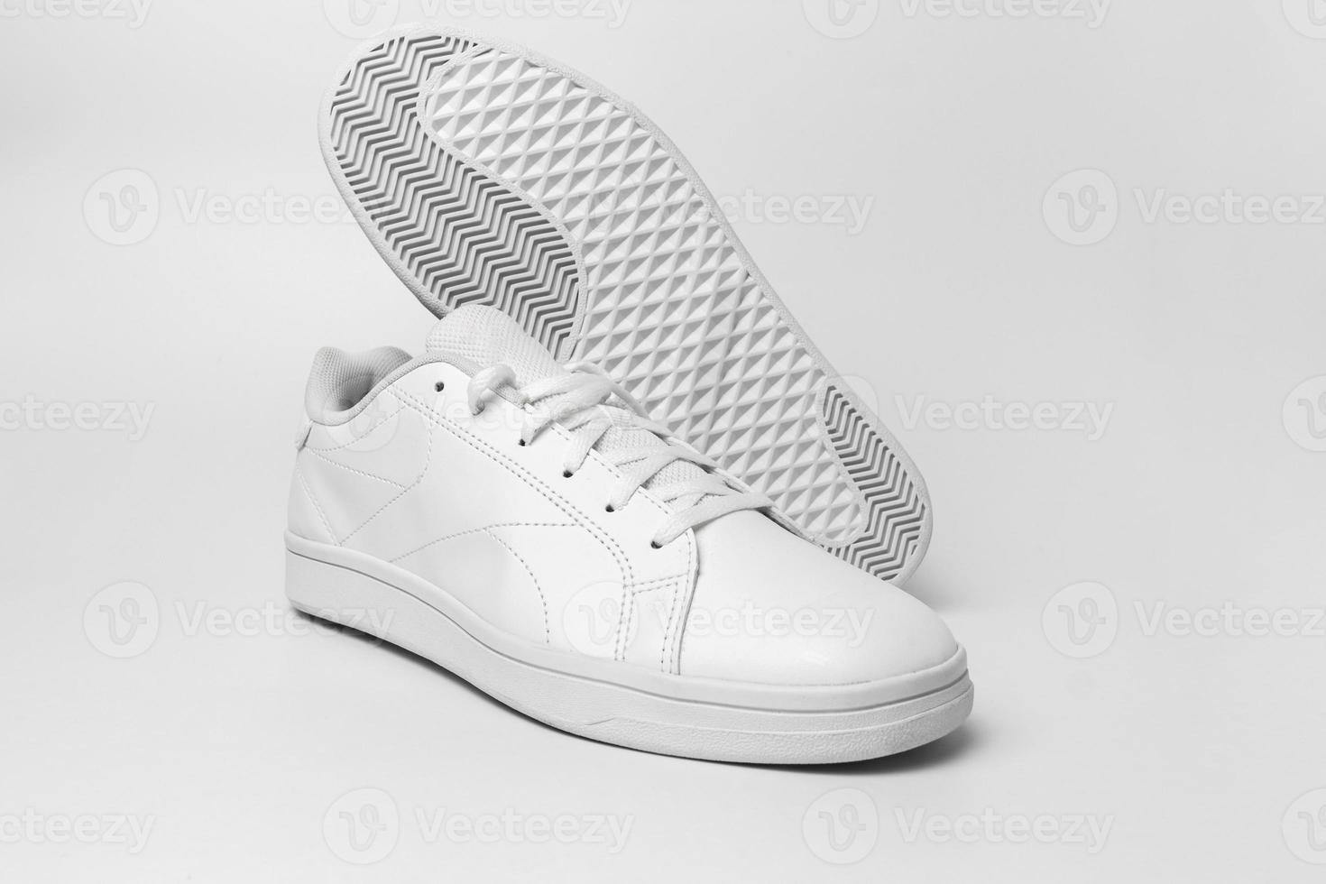 New pair of white sneakers isolated on white background for cutting out ...