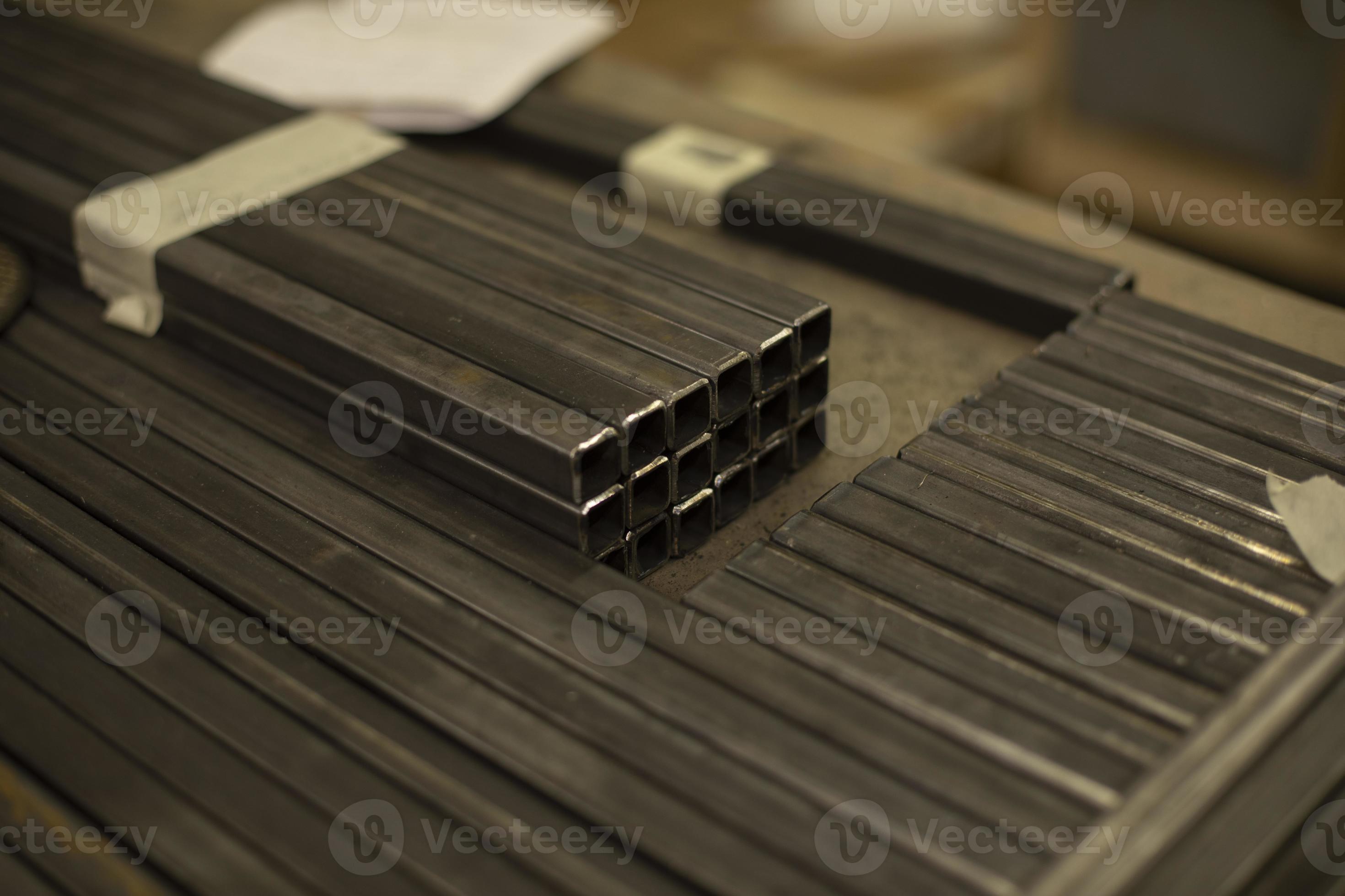 Steel profile in workshop. Rod made of metal. 13848323 Stock Photo at Vecteezy