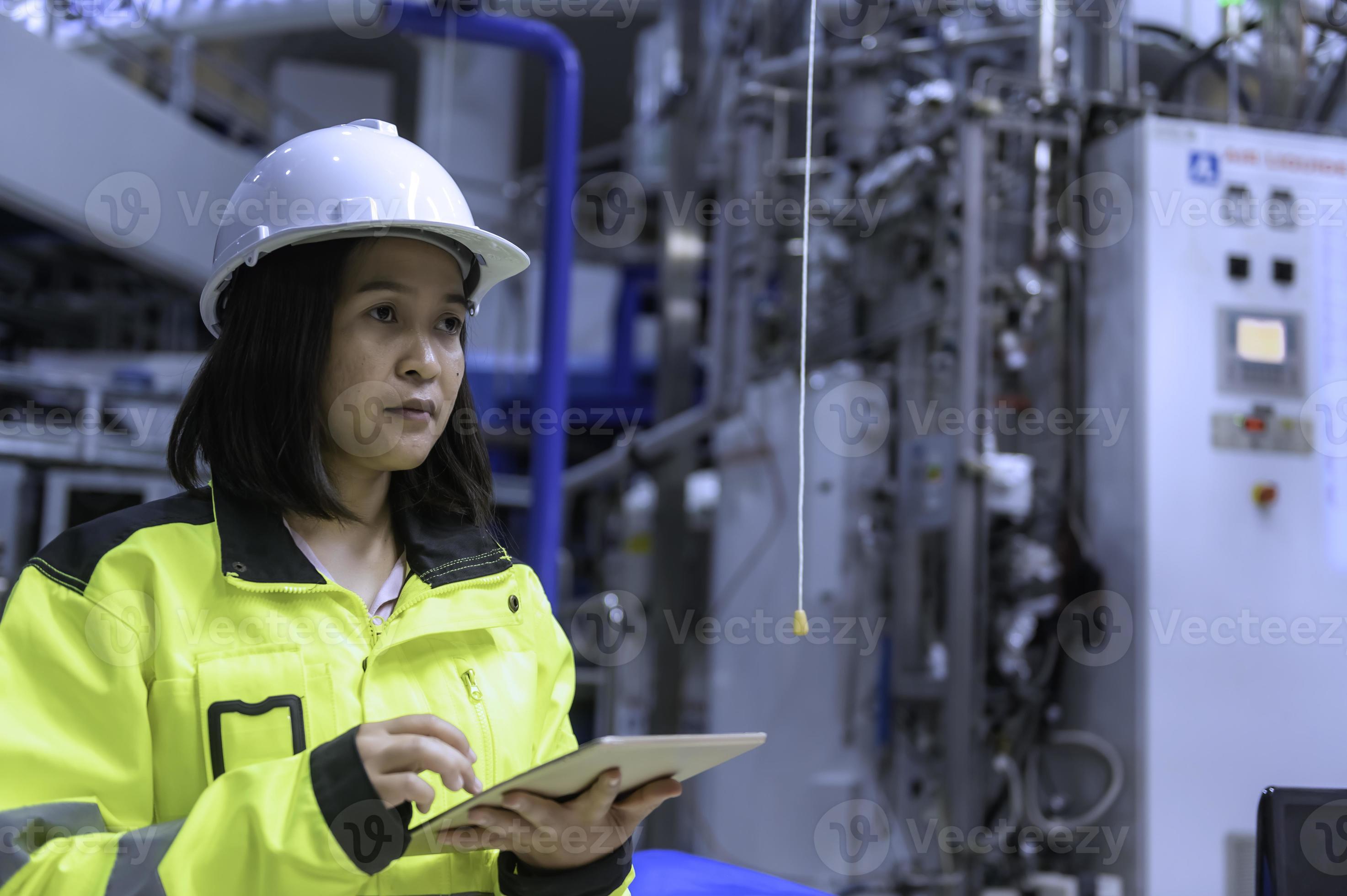 Inside The Large Industry Factory Female Computer Engineer Works On Personal Computer She Coding