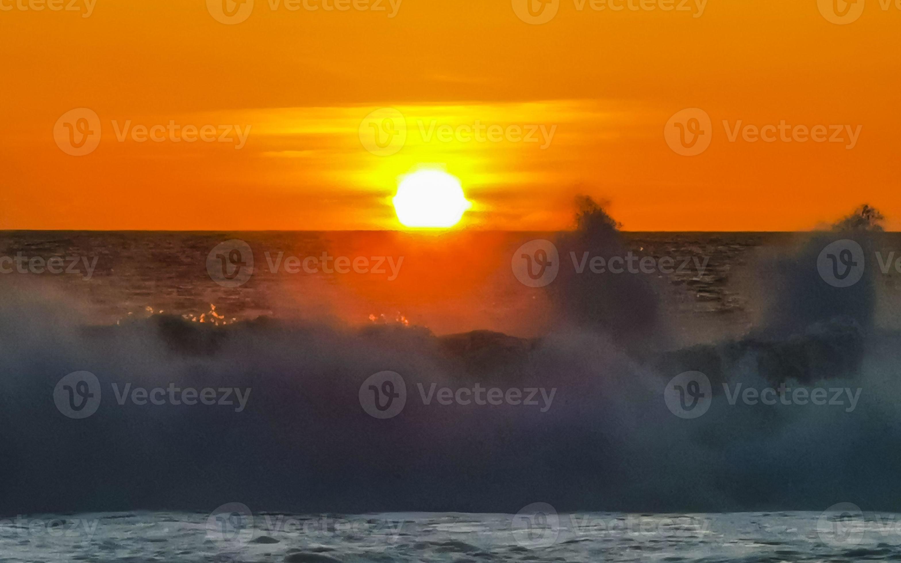 Colorful golden sunset big wave and beach Puerto Escondido Mexico ...