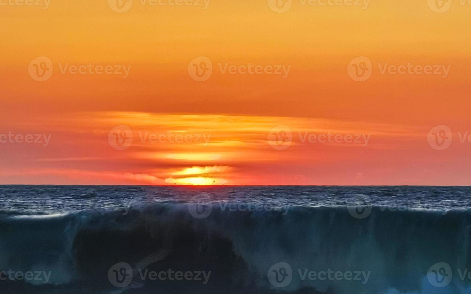 Colorful golden sunset big wave and beach Puerto Escondido Mexico ...