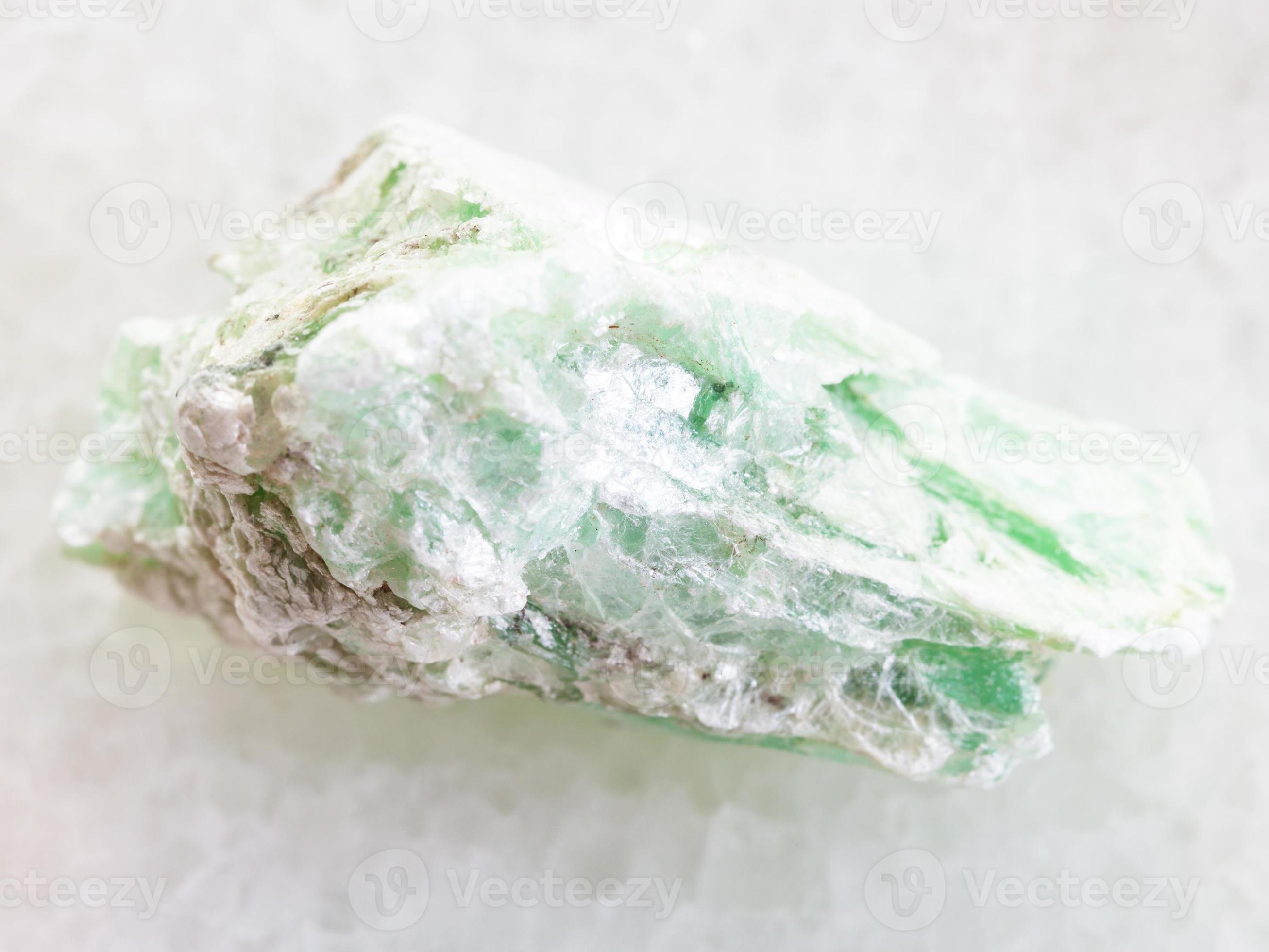 raw green talc stone on white marble 13931926 Stock Photo at Vecteezy