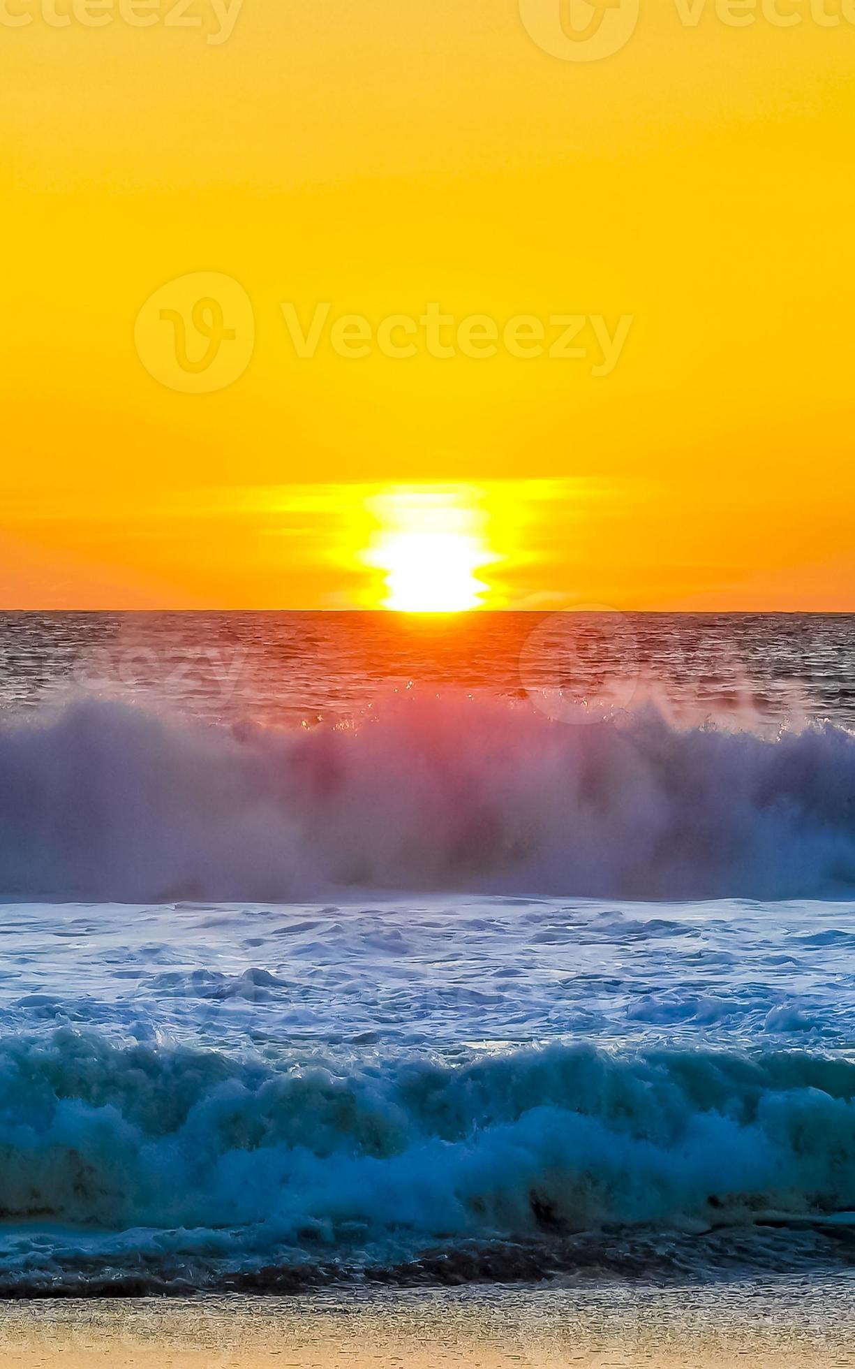 Colorful golden sunset big wave and beach Puerto Escondido Mexico ...