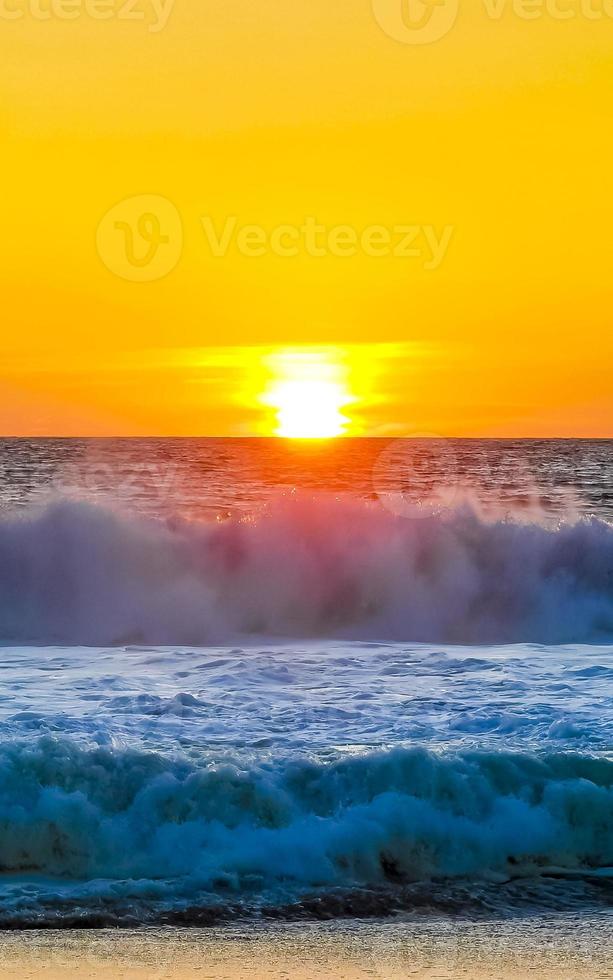 Colorful golden sunset big wave and beach Puerto Escondido Mexico ...