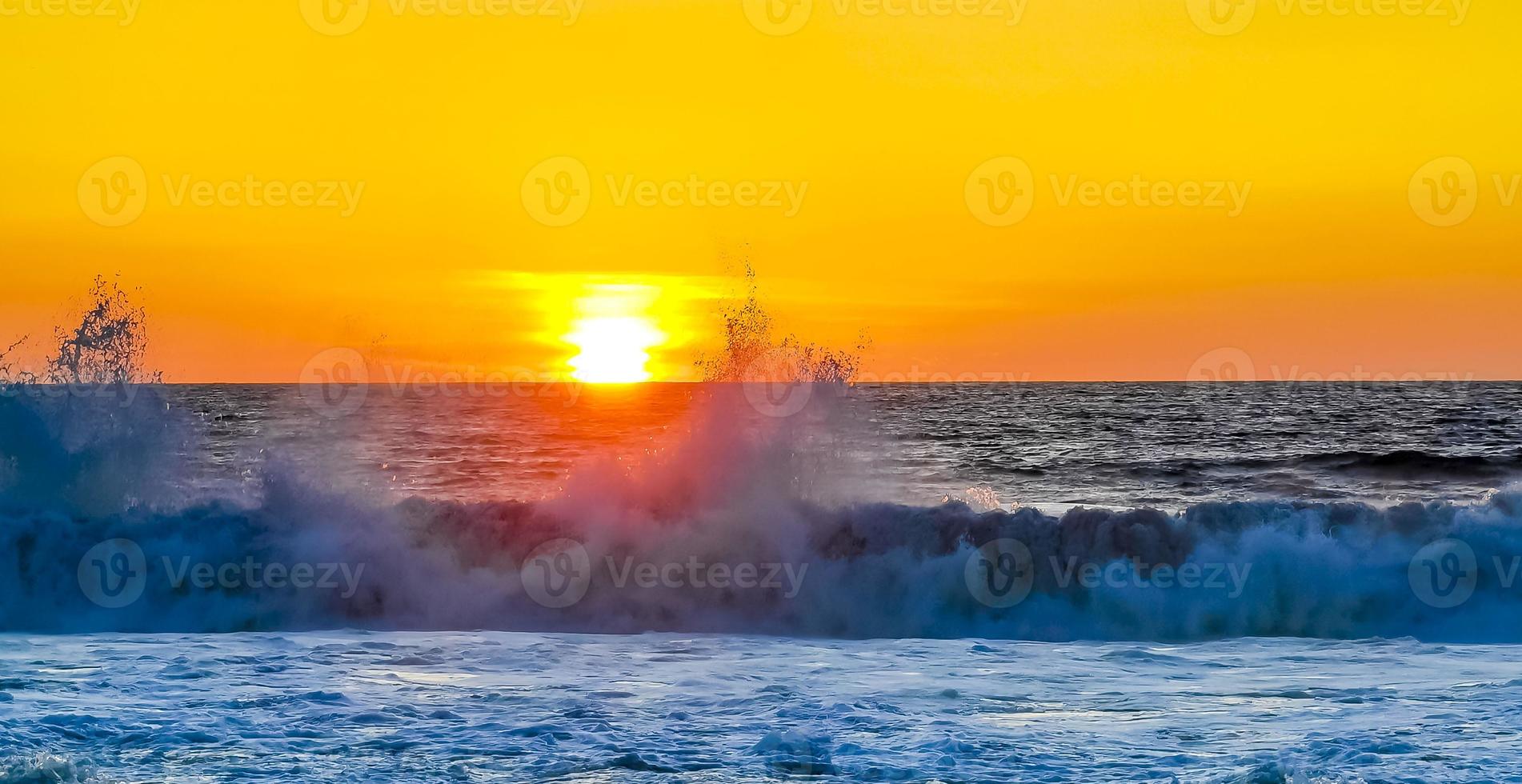 Colorful golden sunset big wave and beach Puerto Escondido Mexico ...