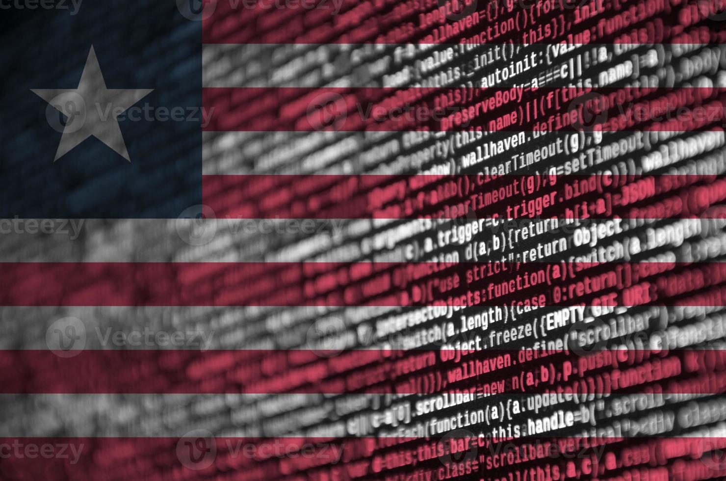 Liberia flag is depicted on the screen with the program code. The concept of modern technology ...