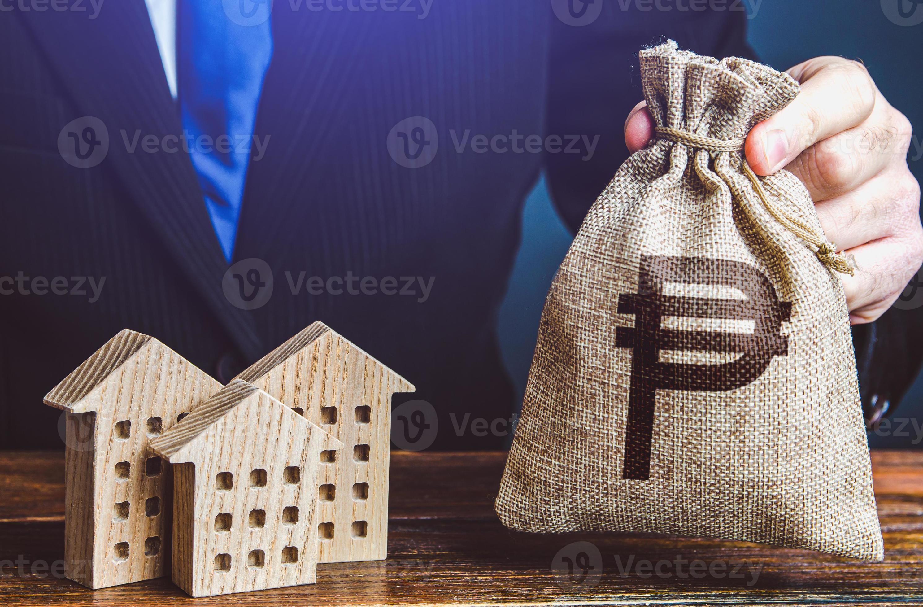 Philippine peso money bags and residential buildings figures. Taxes. Bank offer of mortgage loan ...