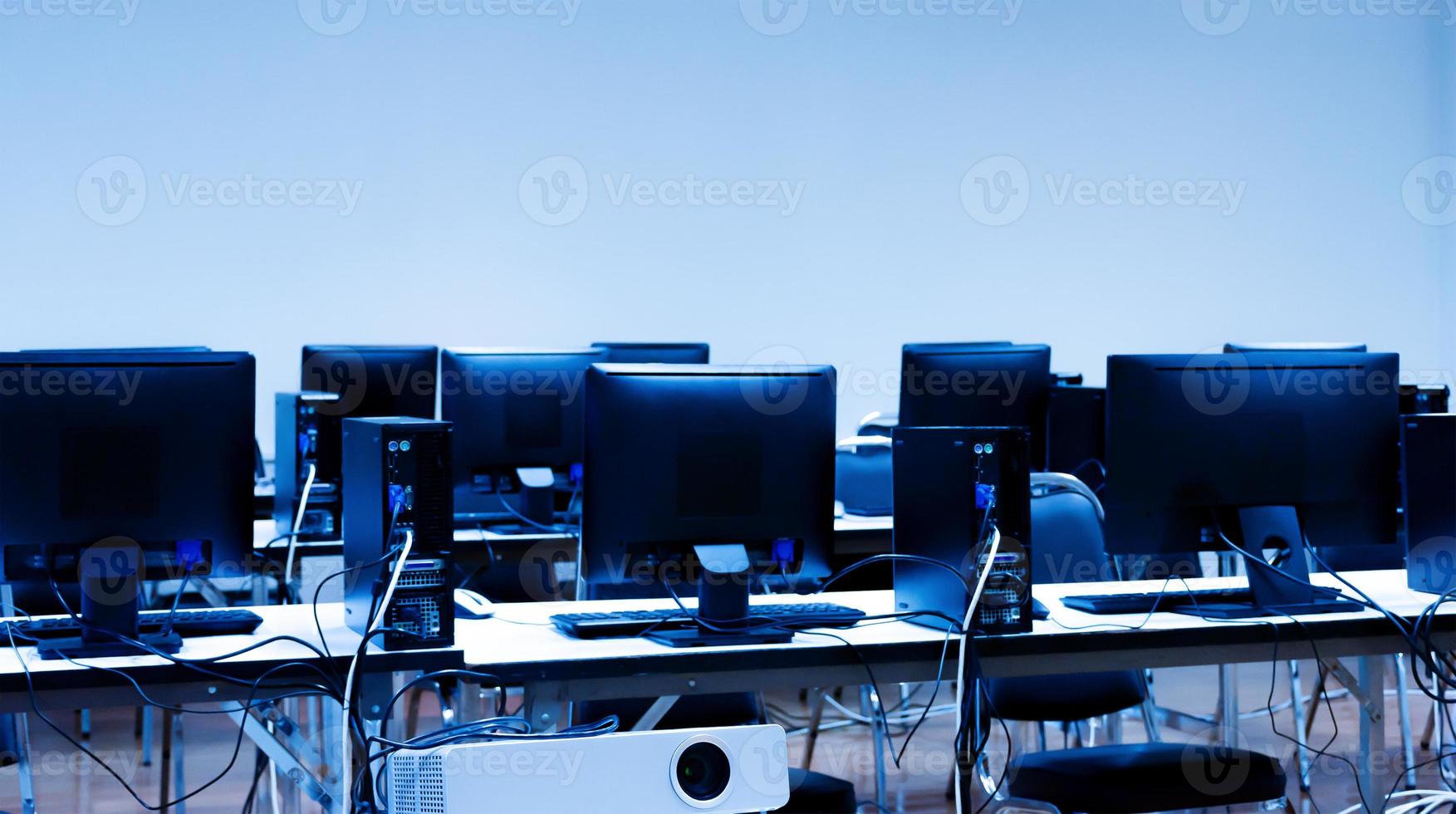 Computer and monitor row in computer class 14012896 Stock Photo at Vecteezy