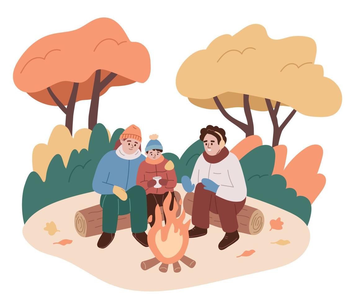 familia sentada junto al fuego en la naturaleza. padre, madre, hijo ... familia sentada junto al fuego en la naturaleza. padre, madre, hijo ...