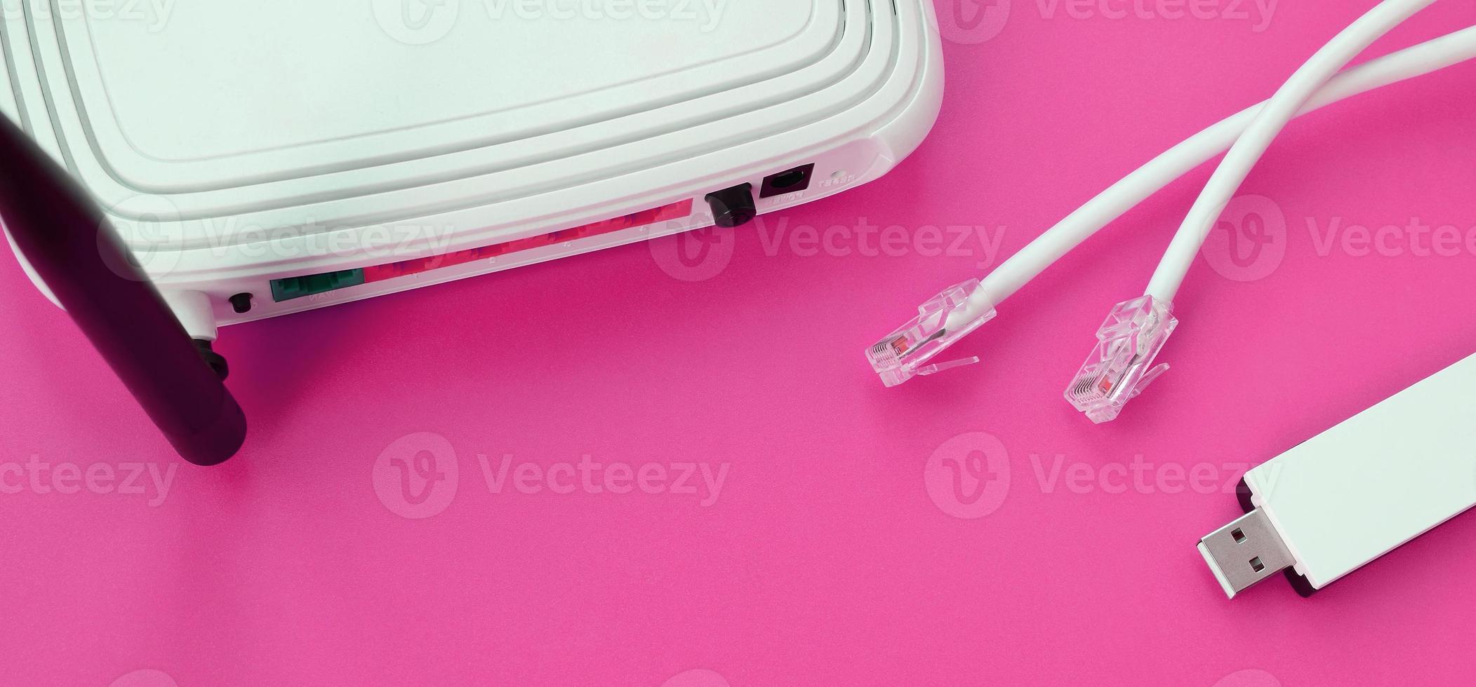 Internet Router Portable Usb Wi Fi Adapter And Internet Cable Plugs Lie On A Bright Pink