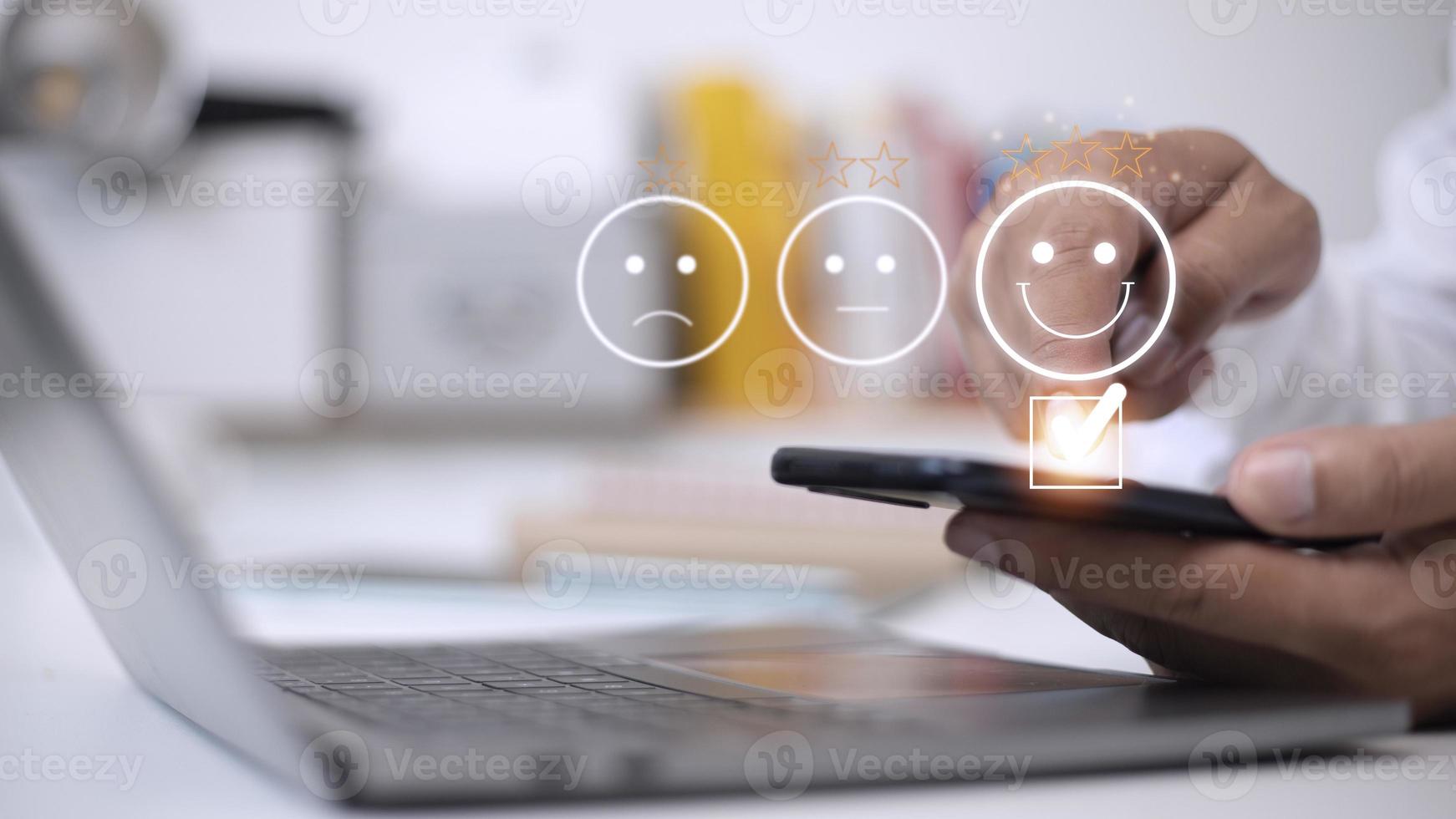 Customer service evaluation concept. using a smartphone is pressing ...