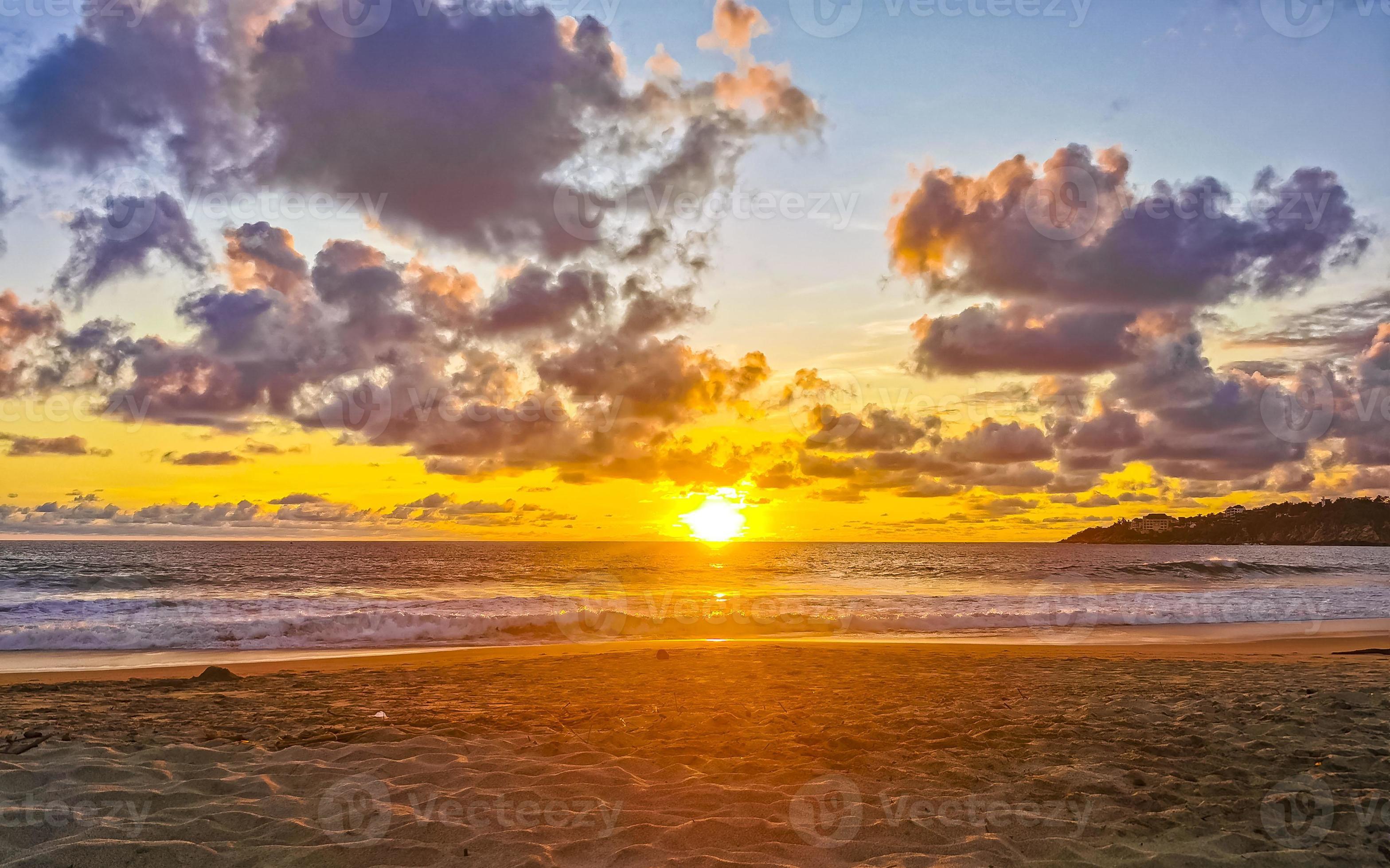 Colorful golden sunset big wave and beach Puerto Escondido Mexico ...