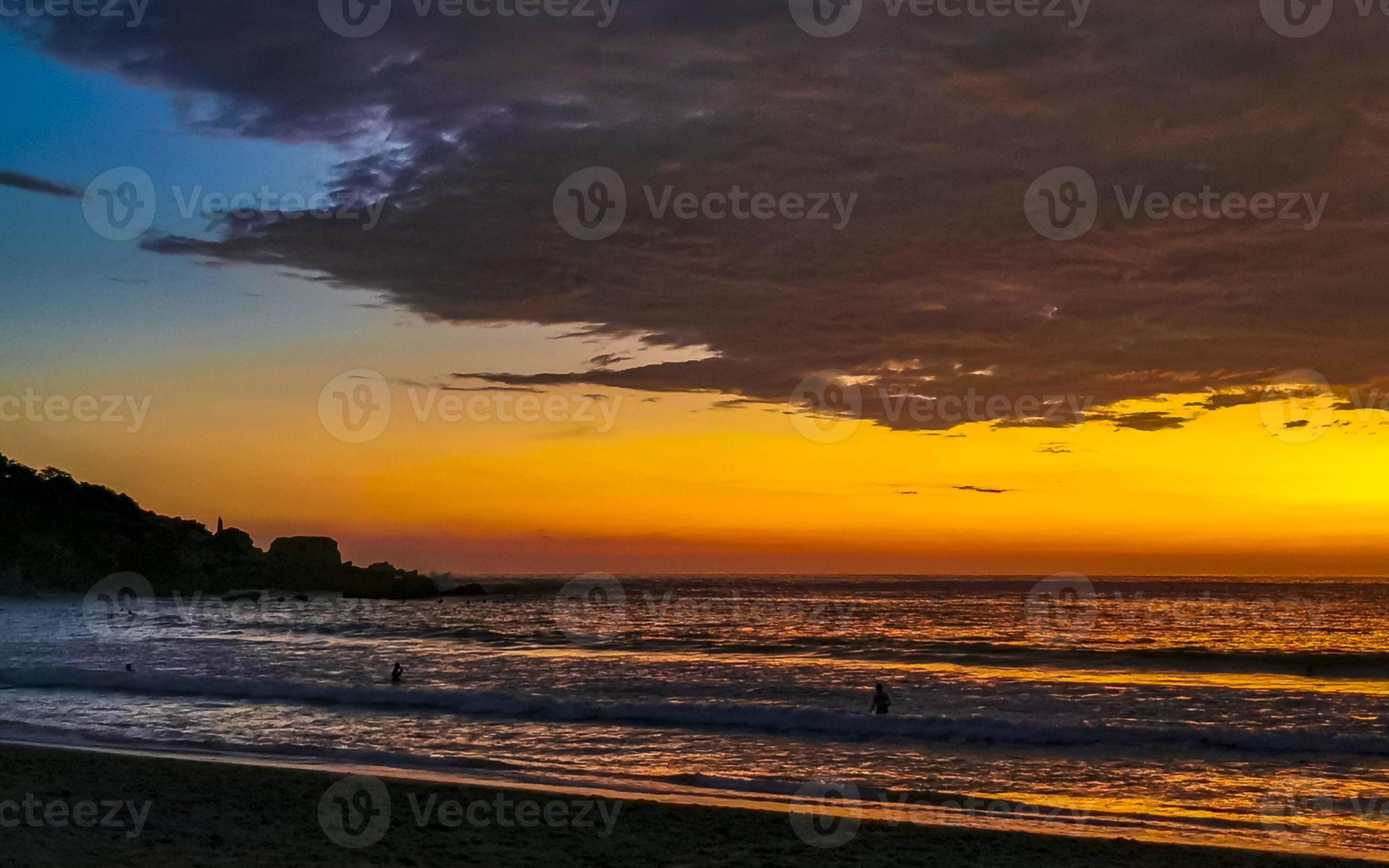 Colorful golden sunset big wave and beach Puerto Escondido Mexico ...