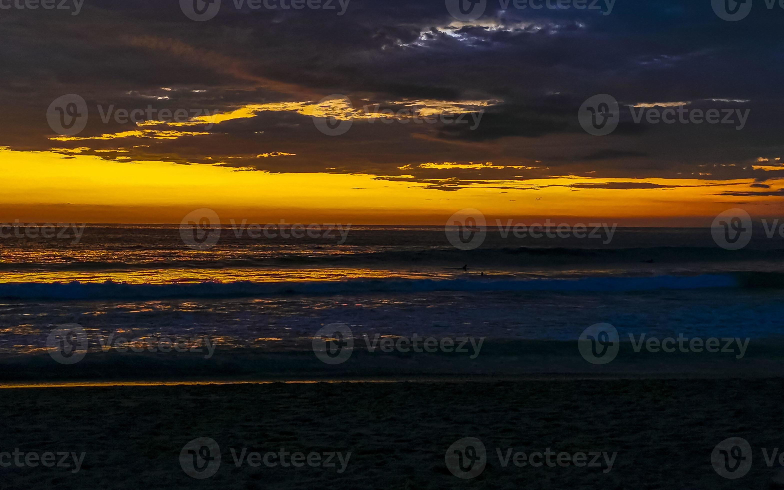 Colorful golden sunset big wave and beach Puerto Escondido Mexico ...