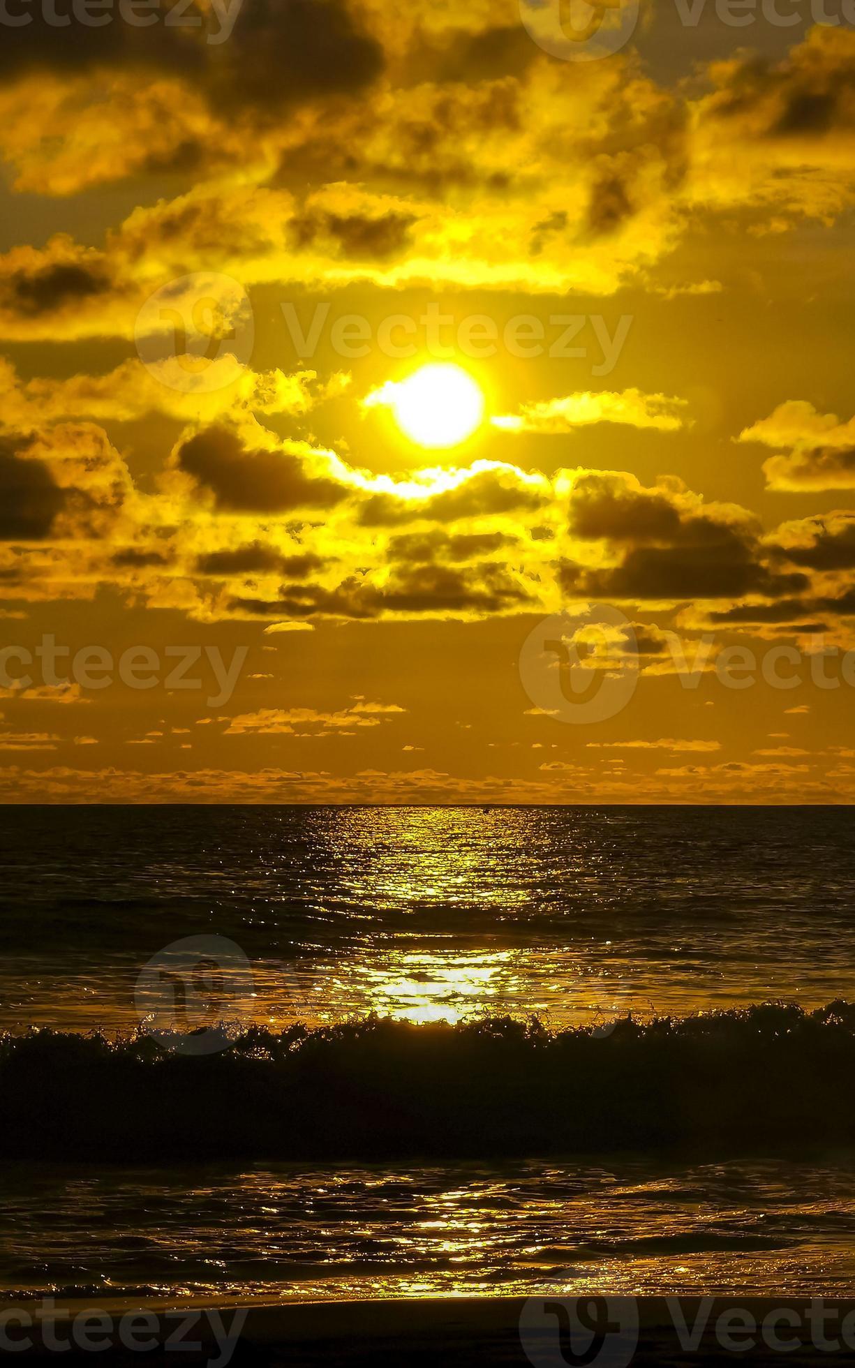 Colorful golden sunset big wave and beach Puerto Escondido Mexico ...