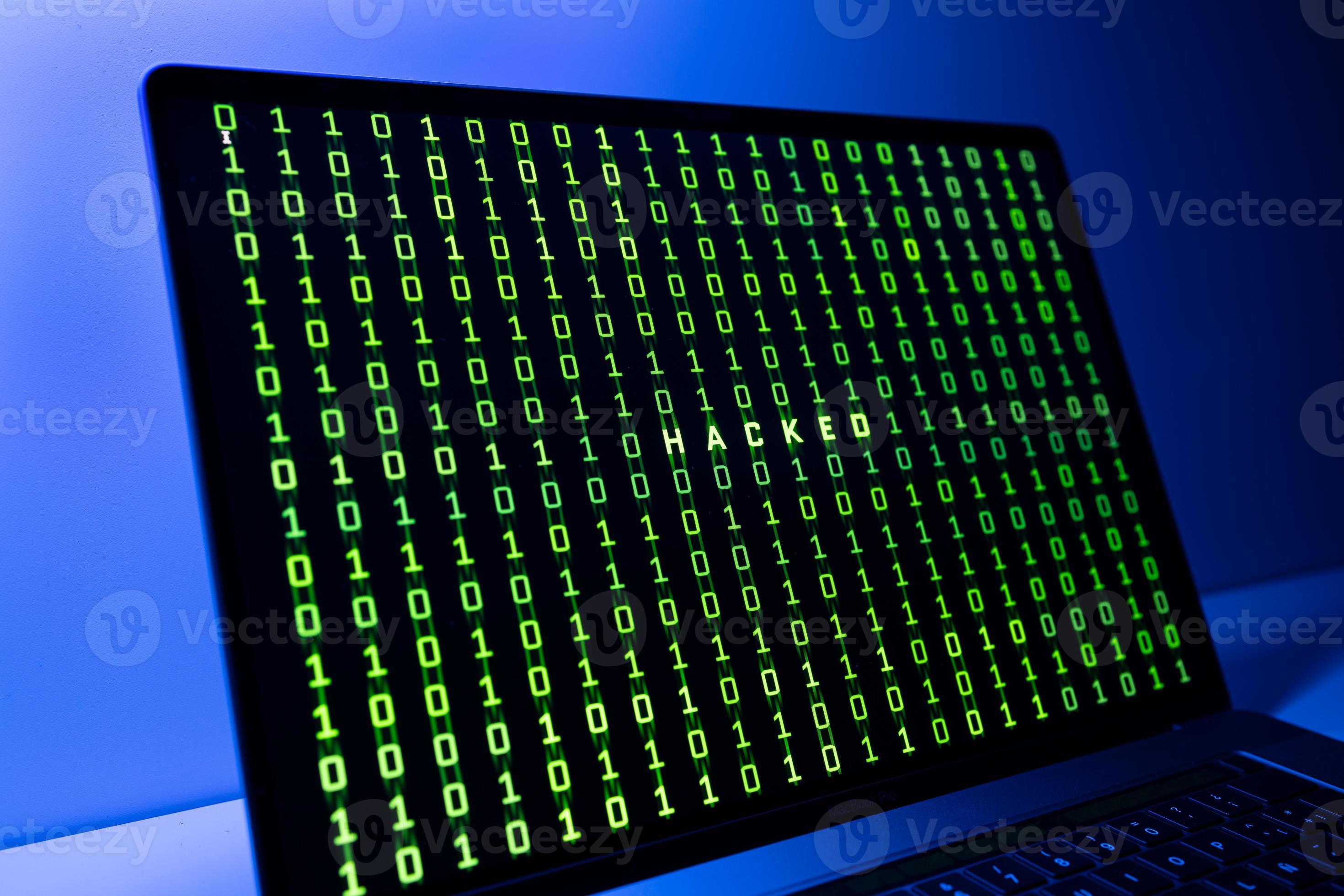 Computer Hacked Concept Laptop Screen With Hacked Word And Binary Code Background 14326740