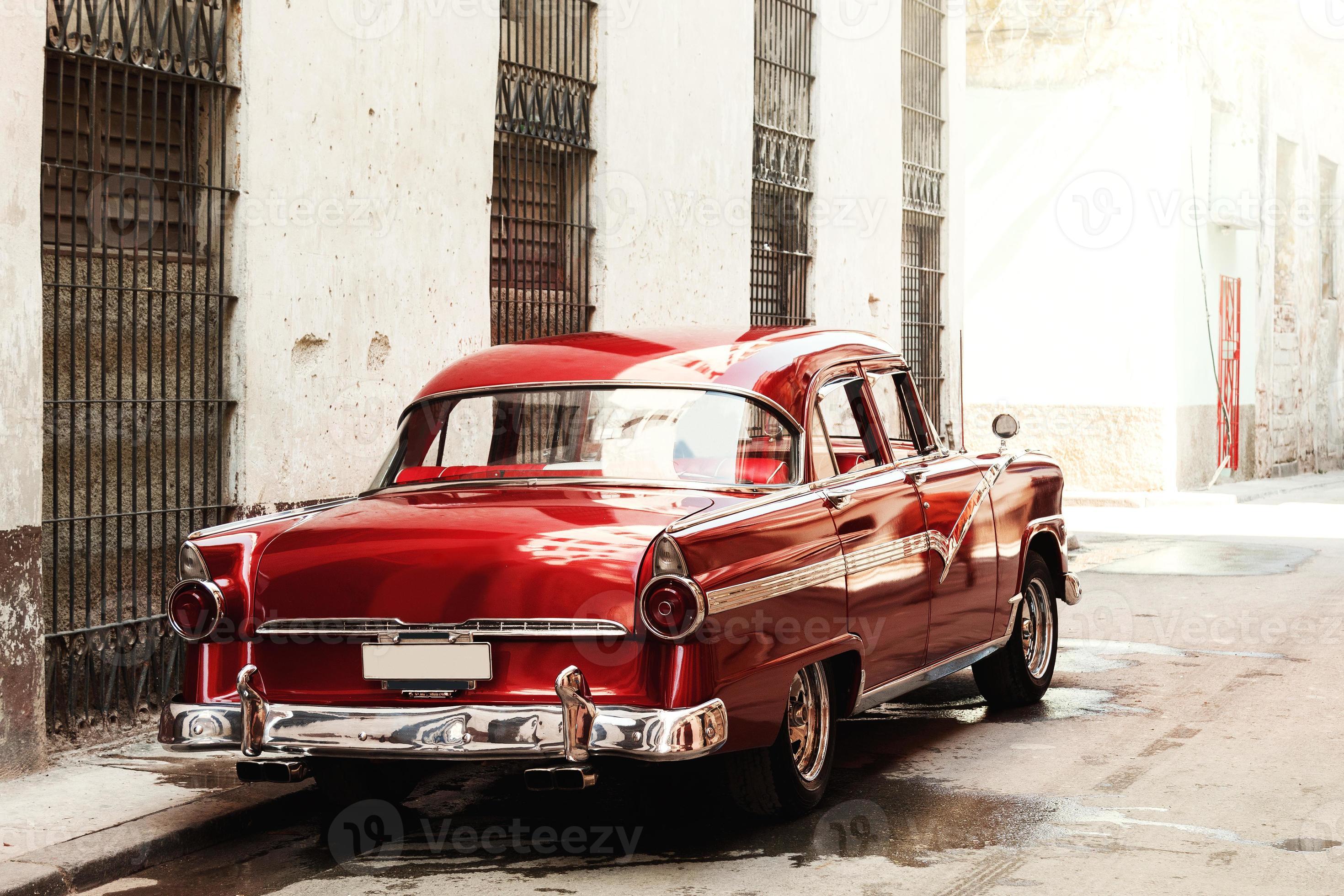 Shiny vintage red car parked on street 14350662 Stock Photo at Vecteezy