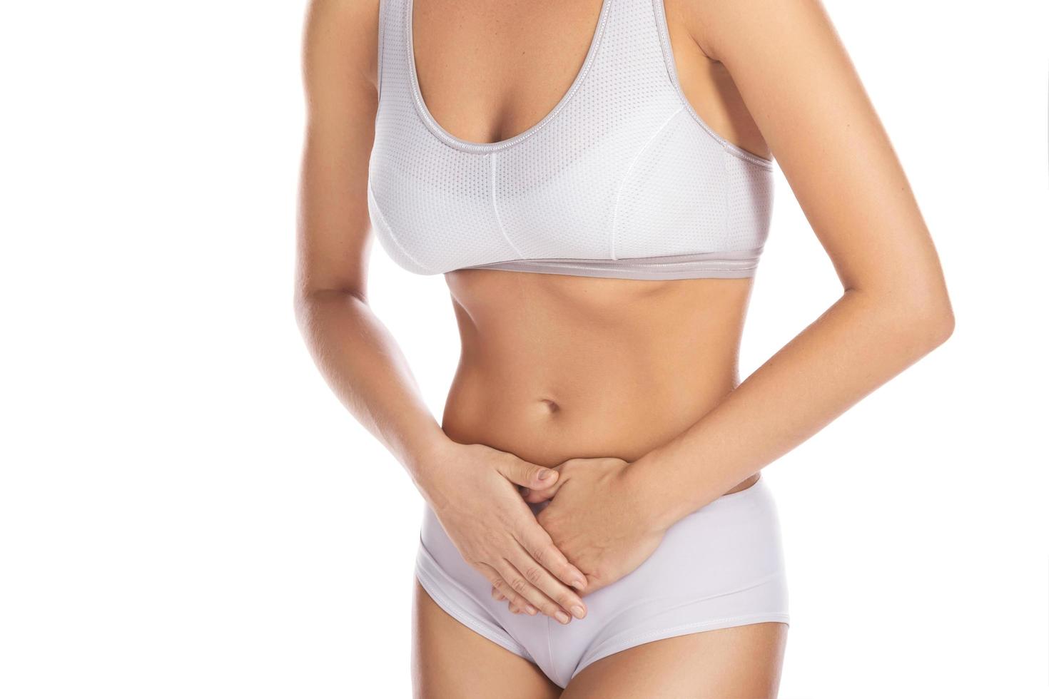 Woman Is Feeling Pain In Lower Part Of Her Stomach 14352621 Stock Photo woman-is-feeling-pain-in-lower-part-of-her-stomach-14352621-stock-photo