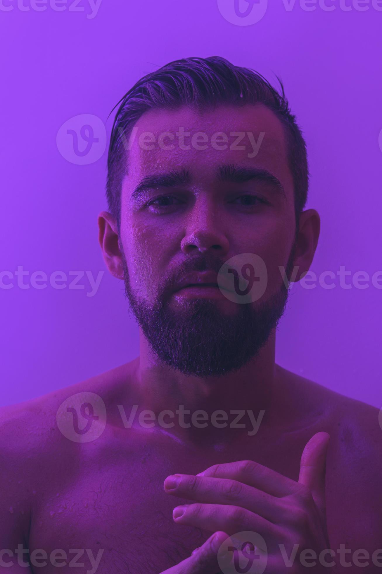 Handsome young man with wet skin in ultraviolet light 14354221 Stock Photo at Vecteezy