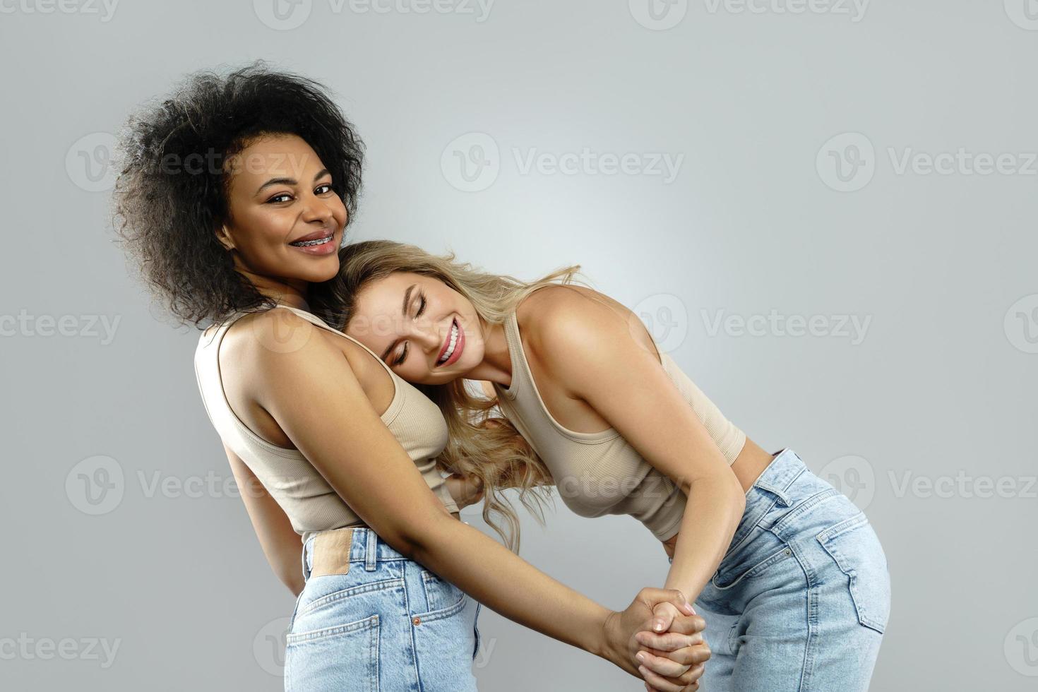 Caucasian And African American Women Holding Hands Concepts