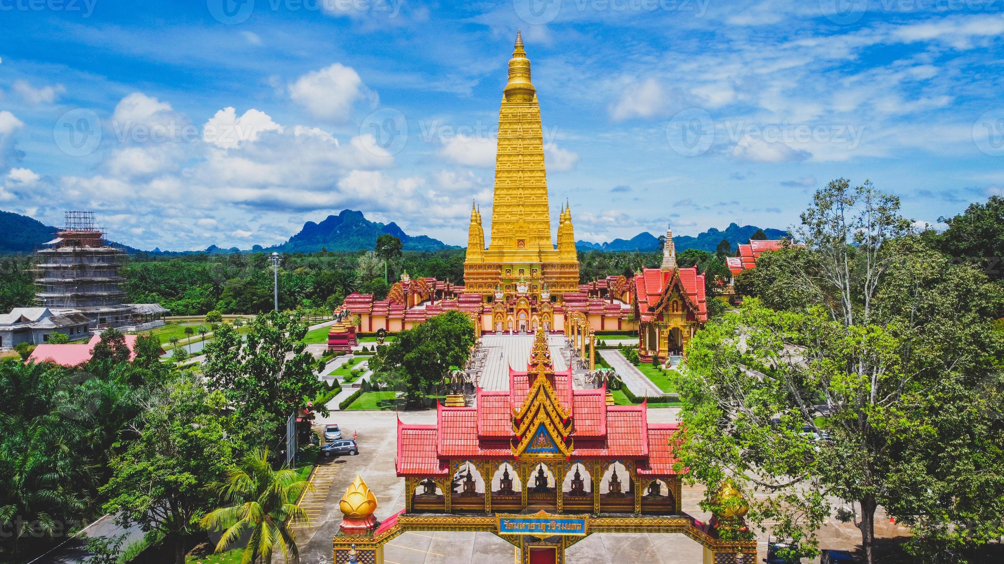 An aerial view of a large temple in Thailand that is beautiful and is a very popular tourist ...