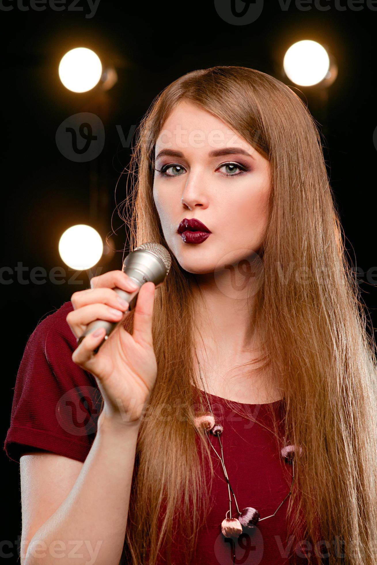 Portrait Of Beautiful Attractive Smiling Blonde Woman Singing In