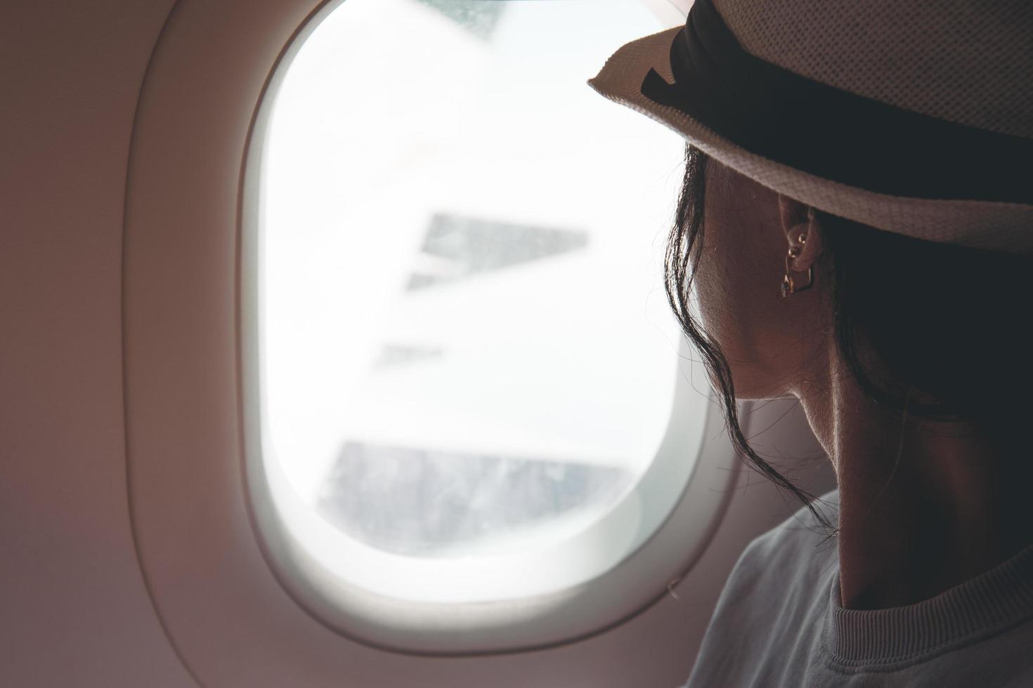 Female tourist in plane 14790021 Stock Photo at Vecteezy