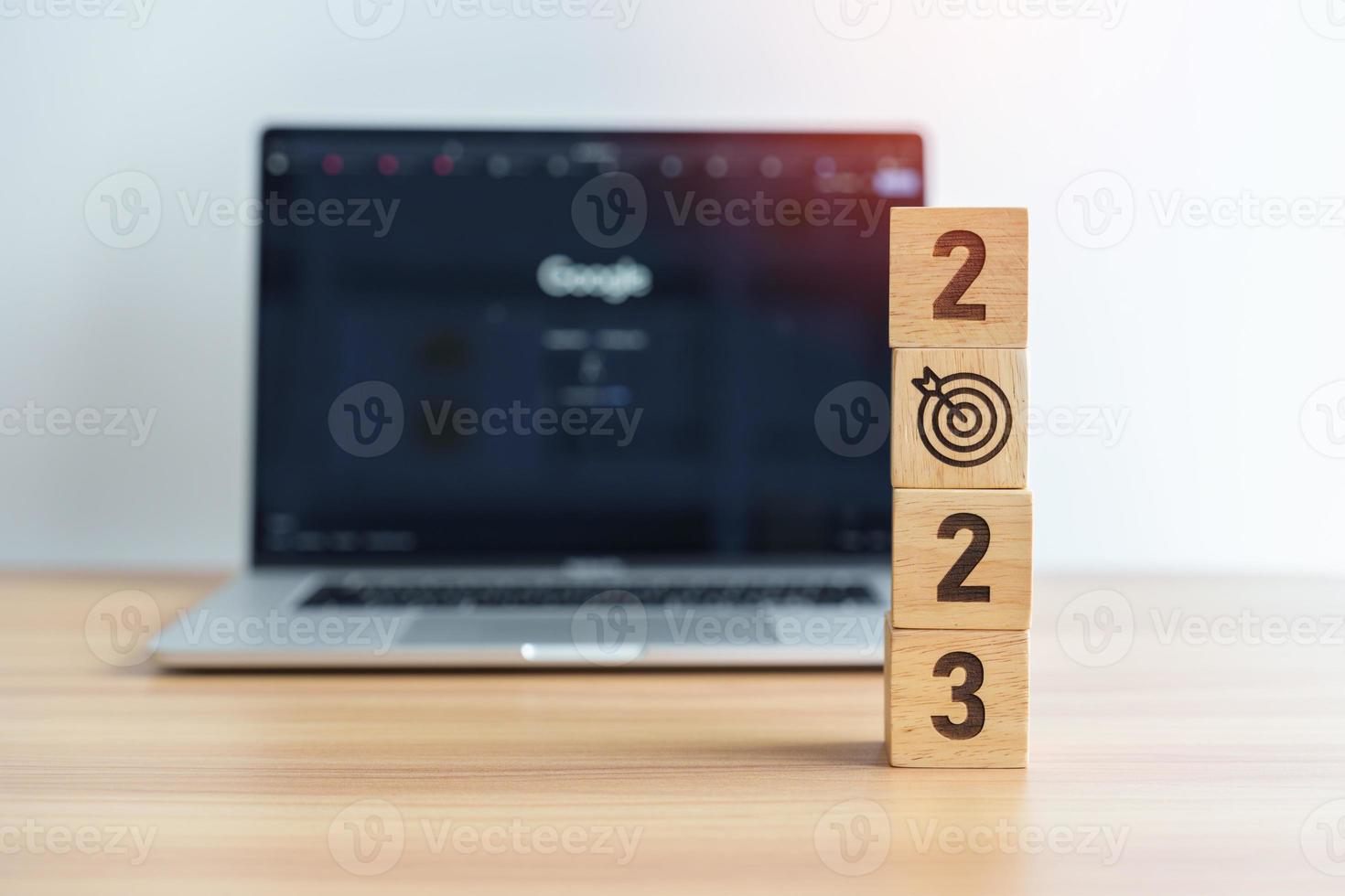 2023 Year block with dartboard icon against computer laptop background. Goal, Target, Resolution ...