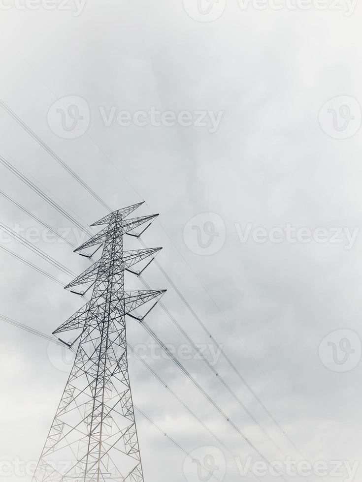 This is a photo of an extra high voltage overhead line tower soaring high into the sky. 14918601 ...