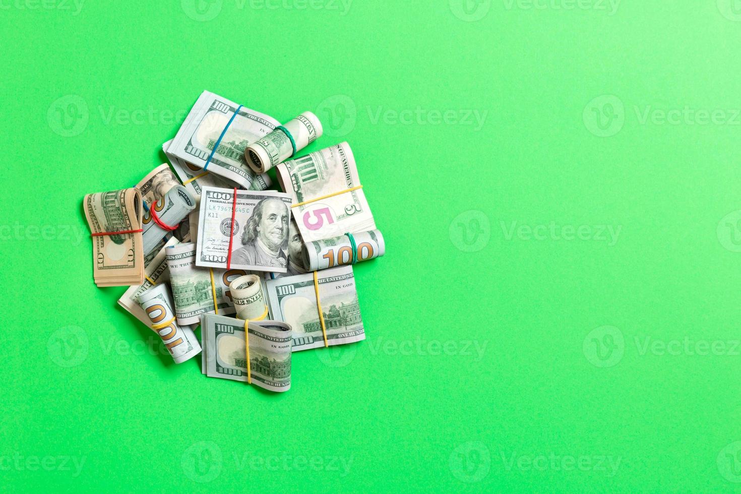 Many Stack Of 100 Dollar Bills Isolated On Colored Background Top Wiev many-stack-of-100-dollar-bills-isolated-on-colored-background-top-wiev
