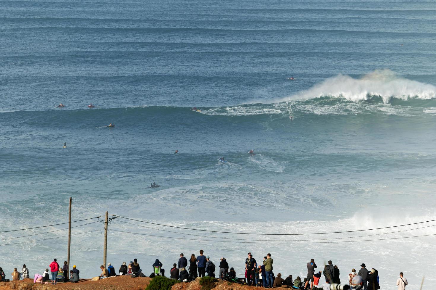 Nazare, Portugal - November 7, 2022 People watching the big giant waves ...