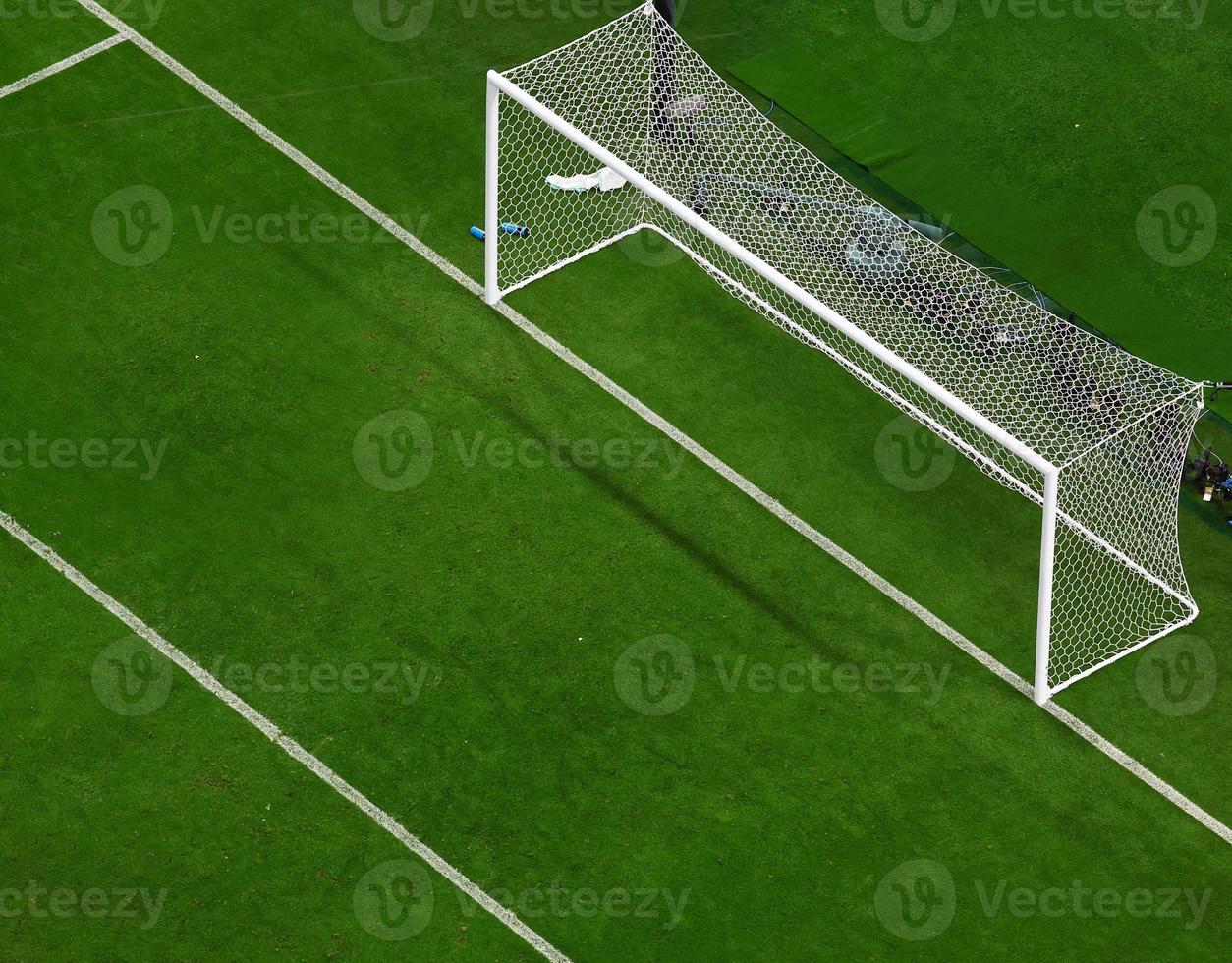 Green football pitch goal post from top view. Football goal with the white mesh on a green lawn ...