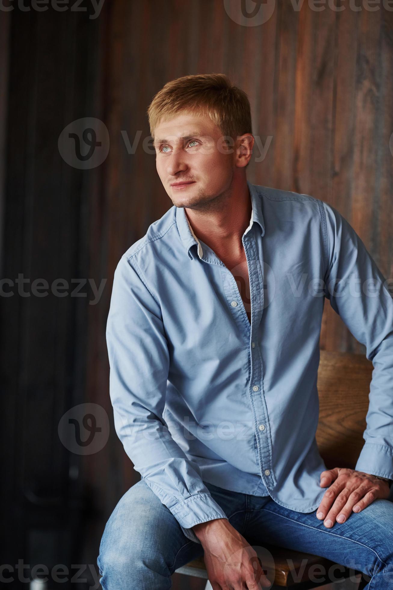 Portrait Of Man In Official Shirt That Posing For The Camera Indoors