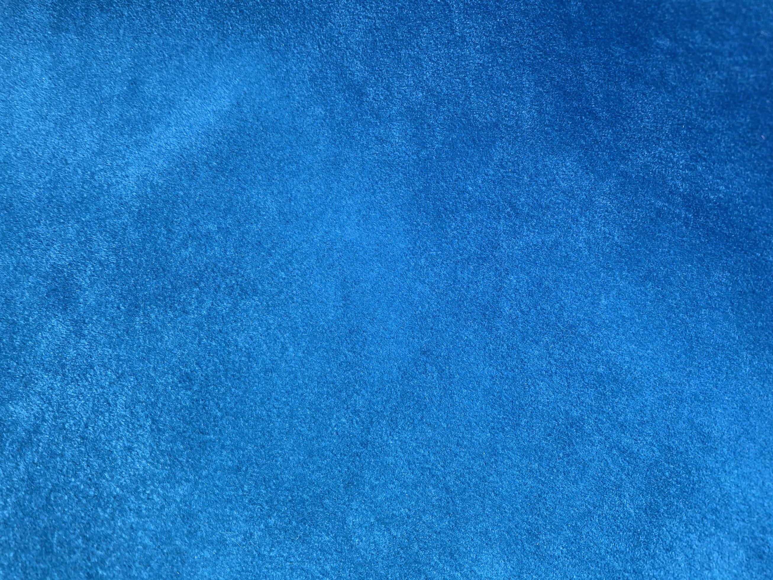 Light blue velvet fabric texture used as background. Empty light blue fabric background of soft ...