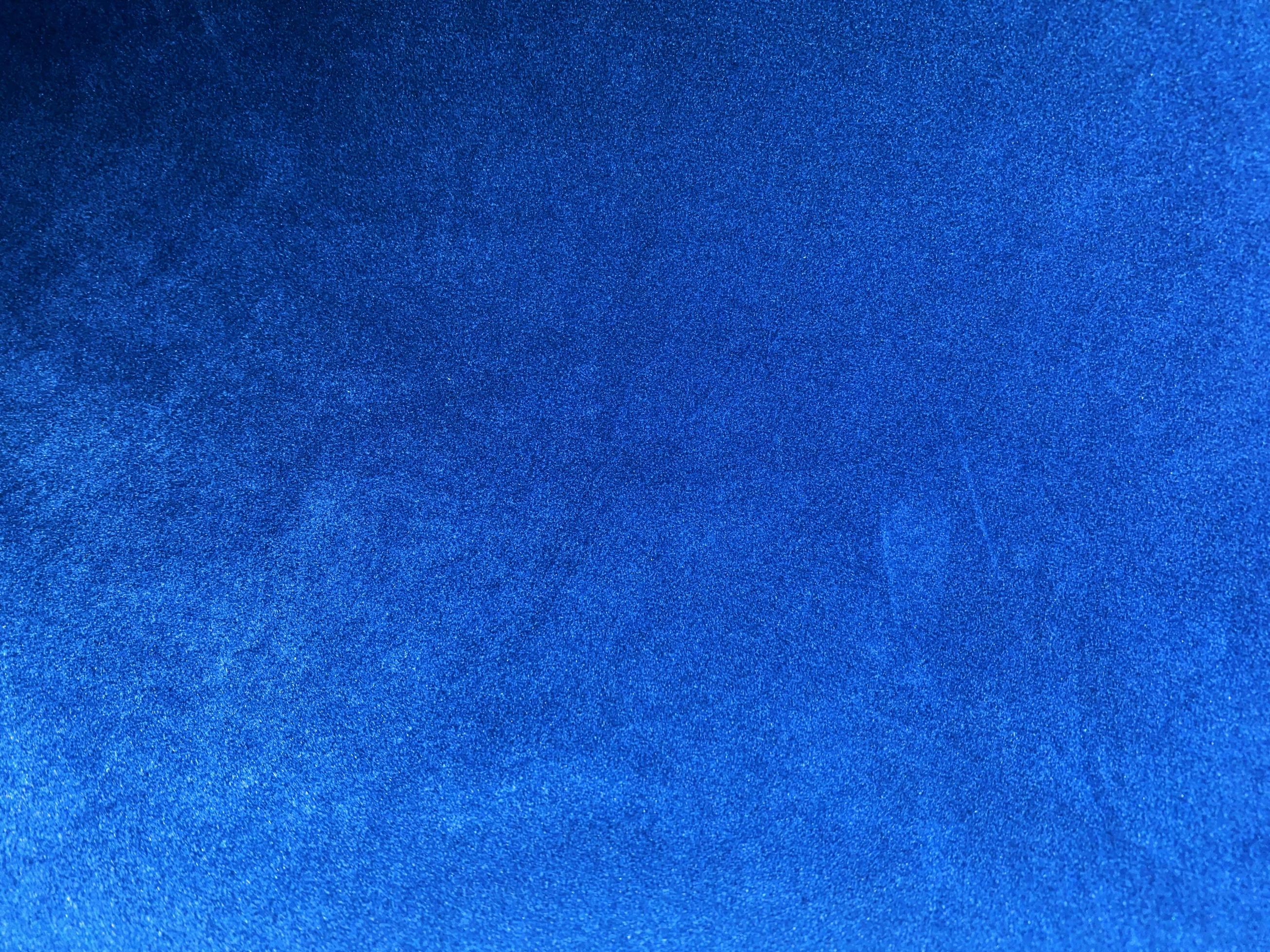 Light blue velvet fabric texture used as background. Empty light blue fabric background of soft ...